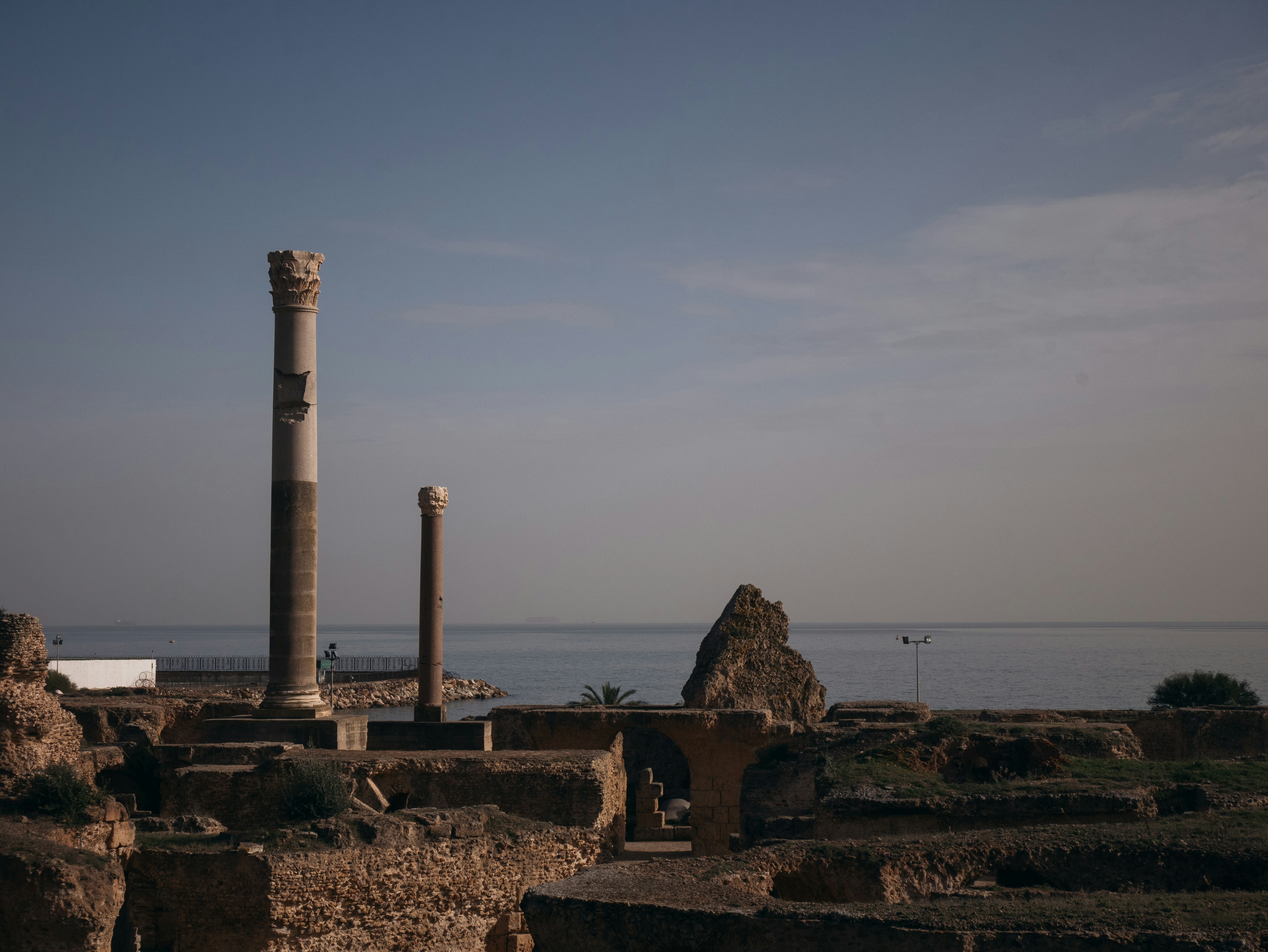 Ancient Columns by the Sea: Ruins Framed Against a Quiet Horizon