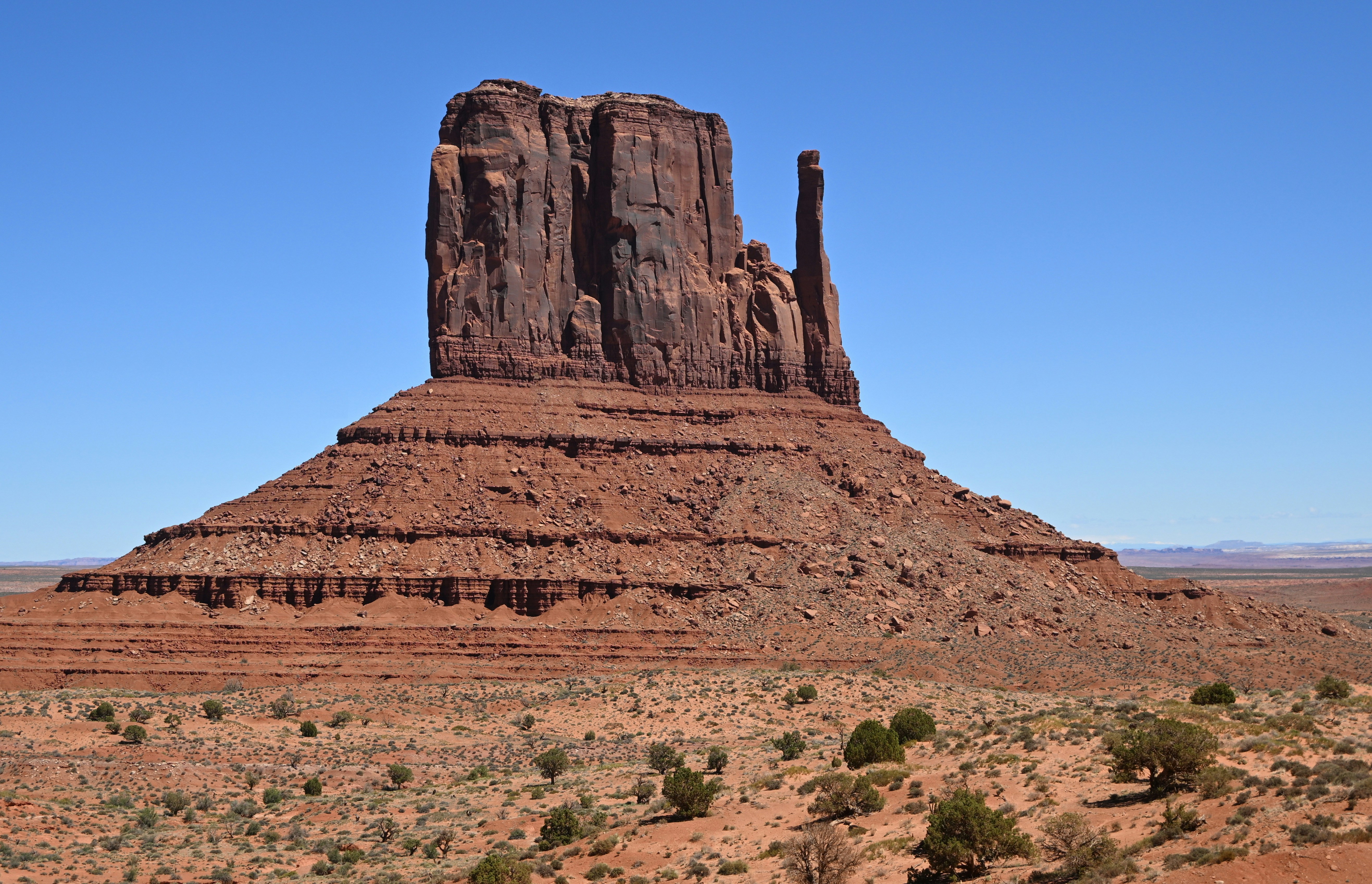 Monument Sentinel: A solitary butte Rises Above Desert Plains