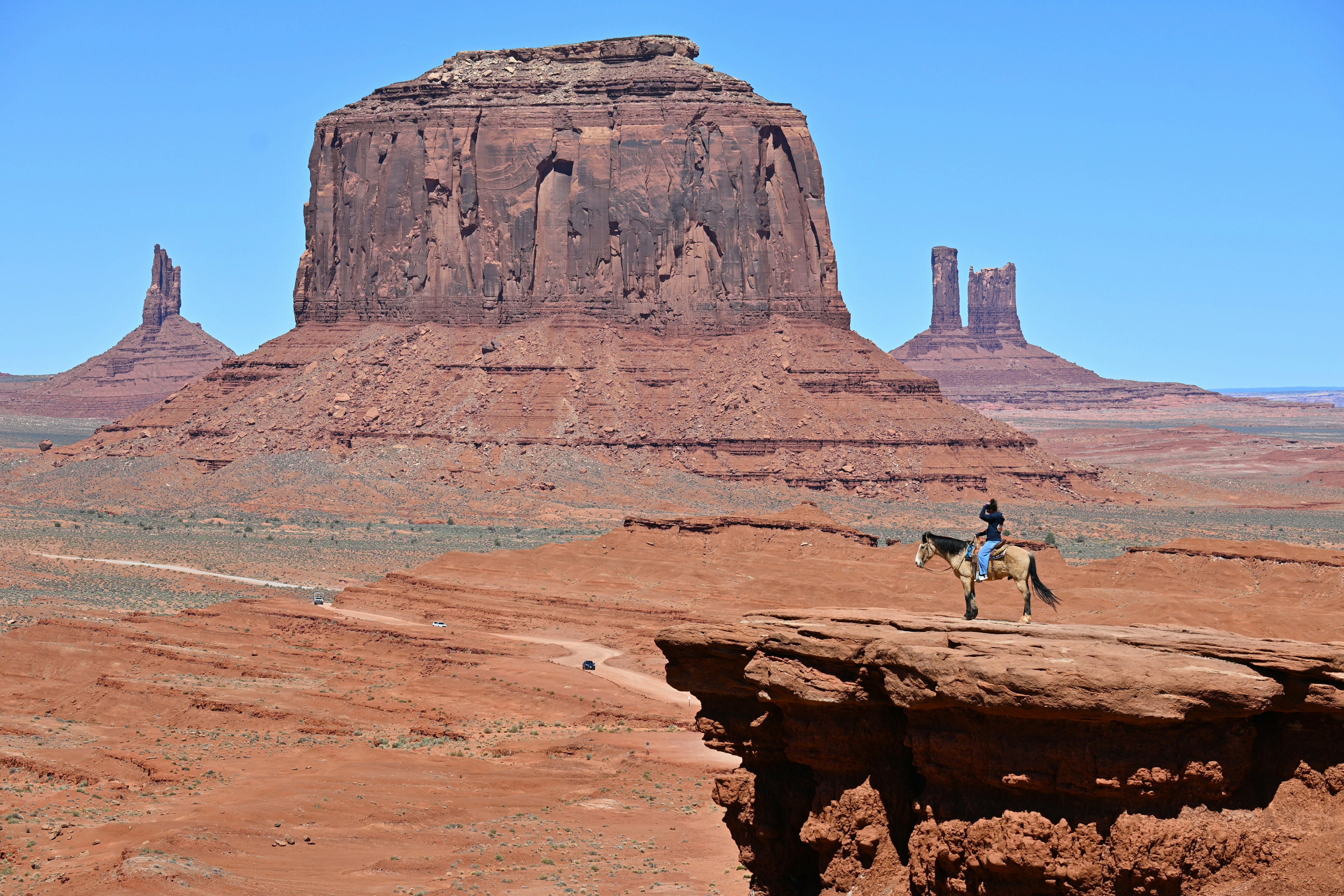 Horseback Rider Crossing the Red Mesa Frontier