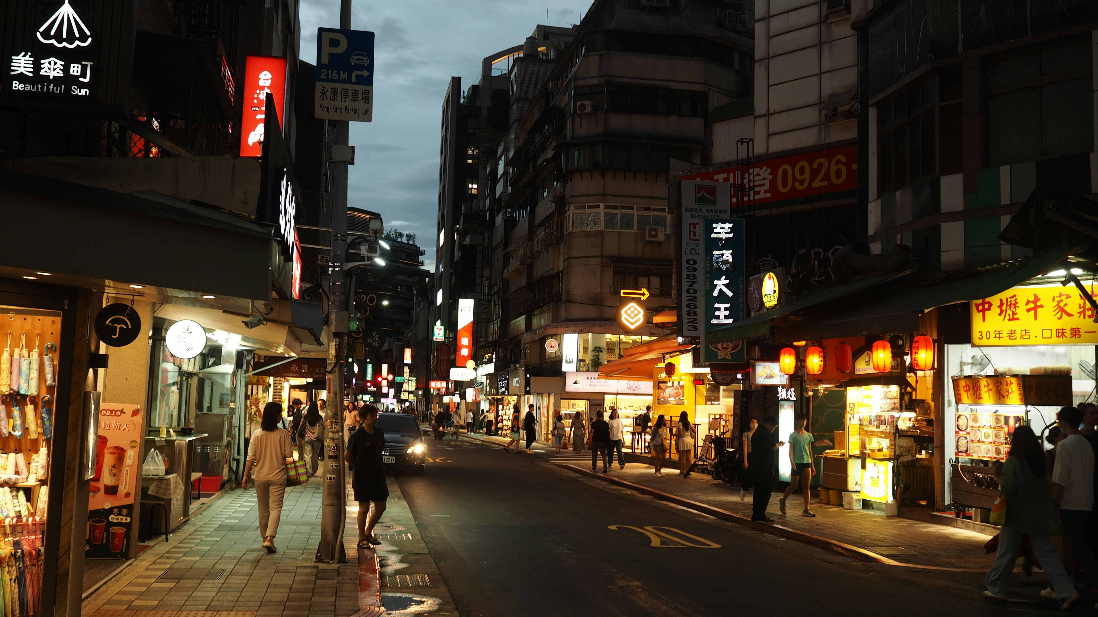 Neon-lit Lane at Dusk: A Quiet Moment Amid City Pulse