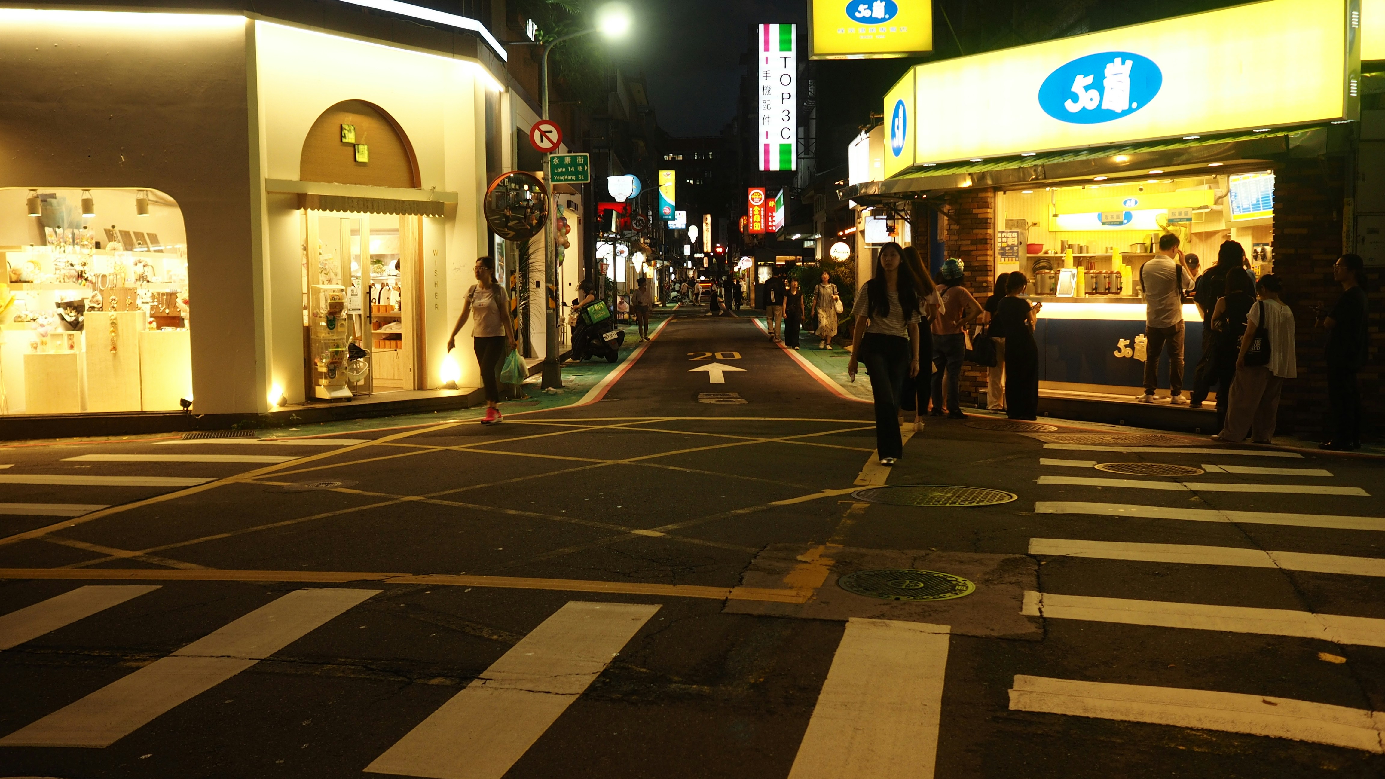 Night Crossing: Neon Pulse Along a Quiet Downtown Street