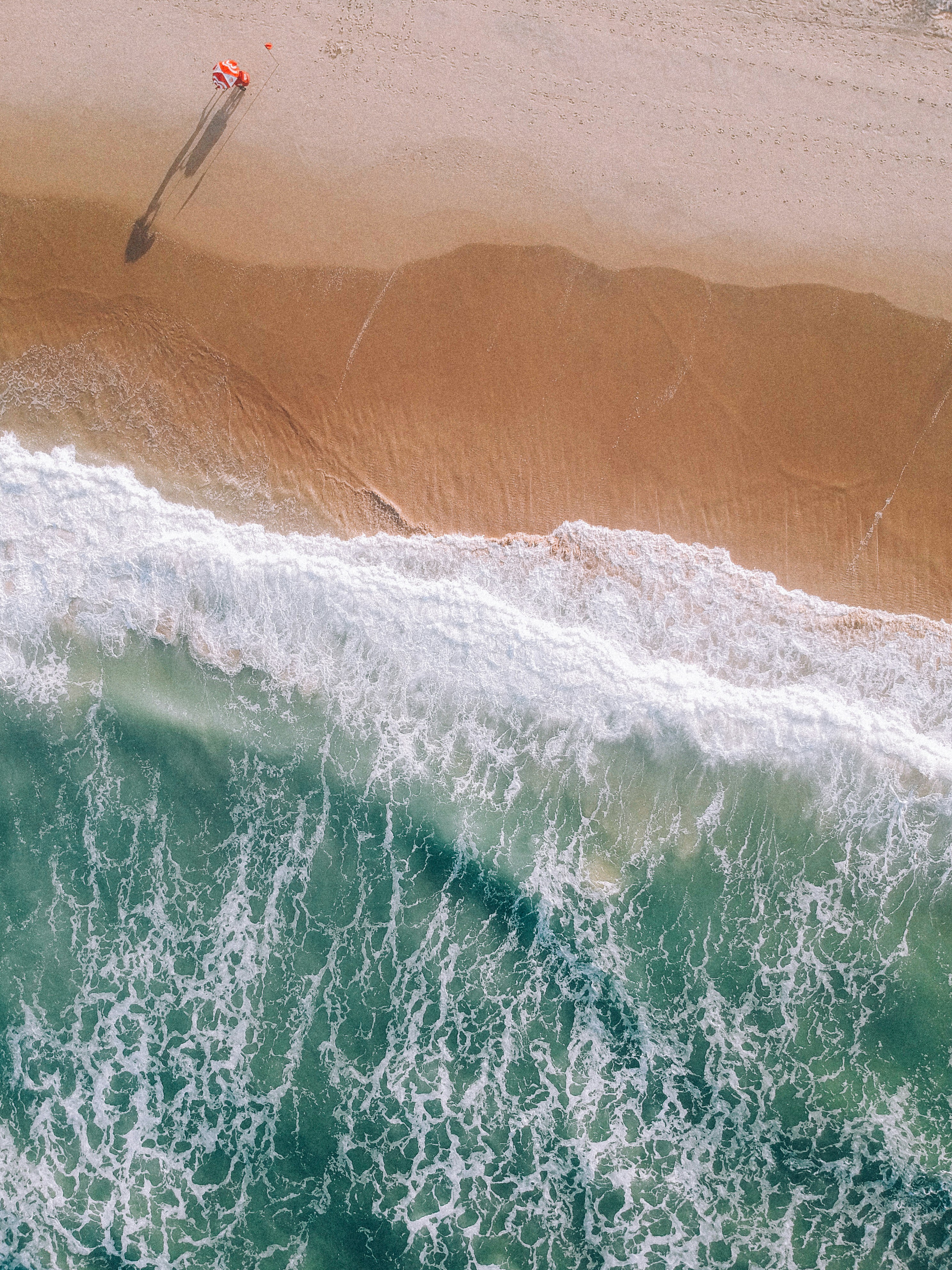 Lone Umbrella on a Quiet Shoreline