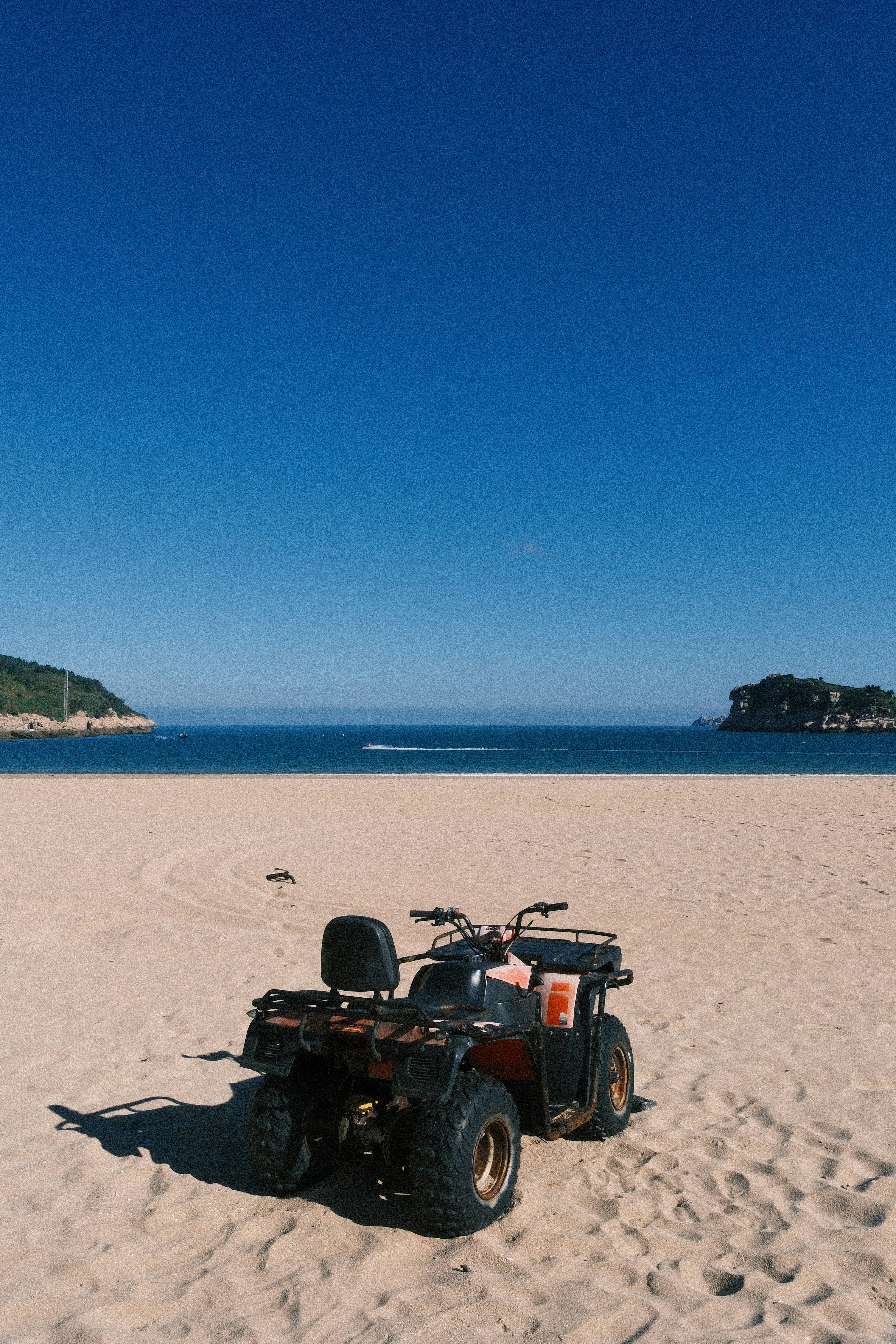 Quad on Quiet Sand: A Beach Ride Toward the Sea