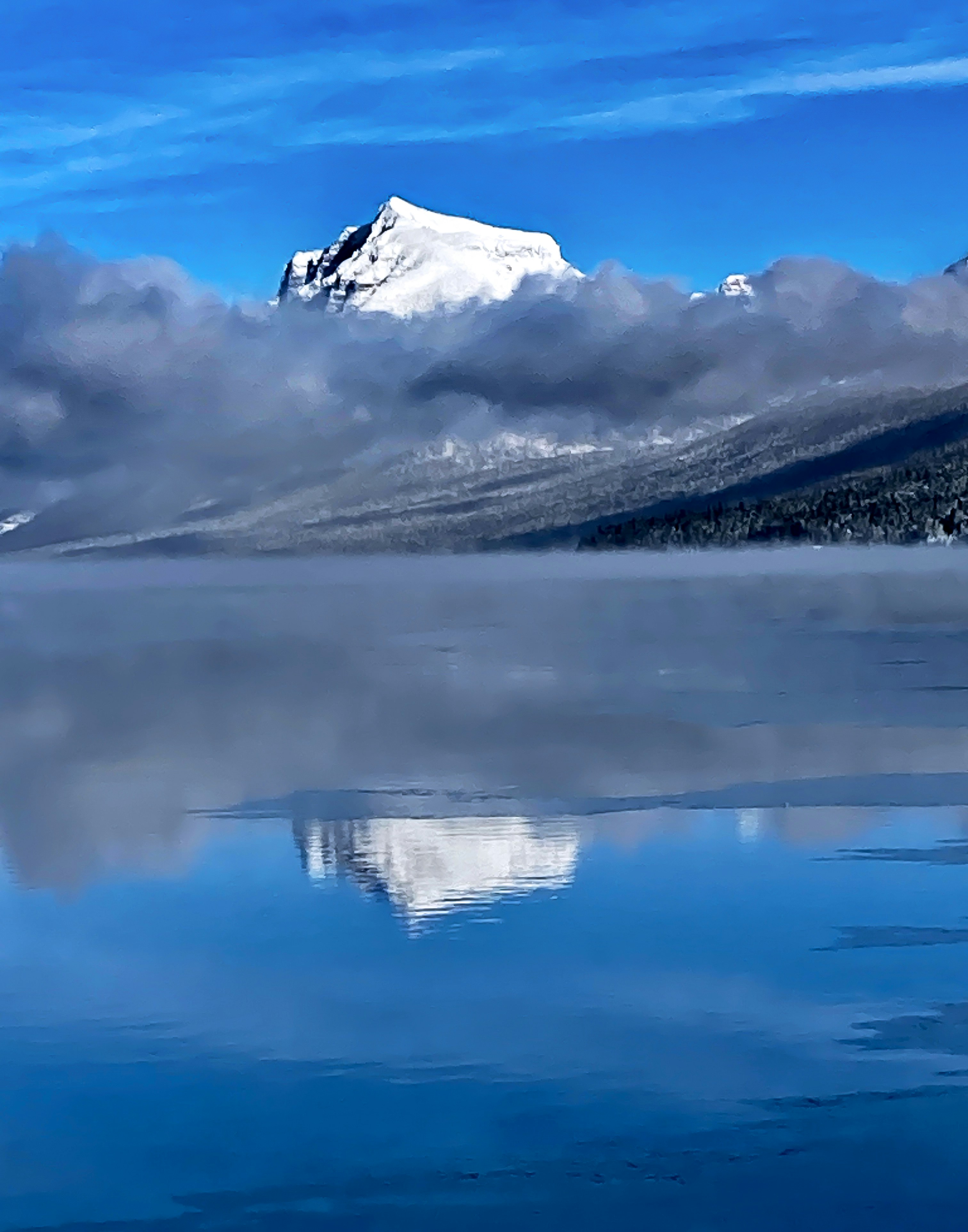 Glacial Peak Rising Through a Sea of Clouds