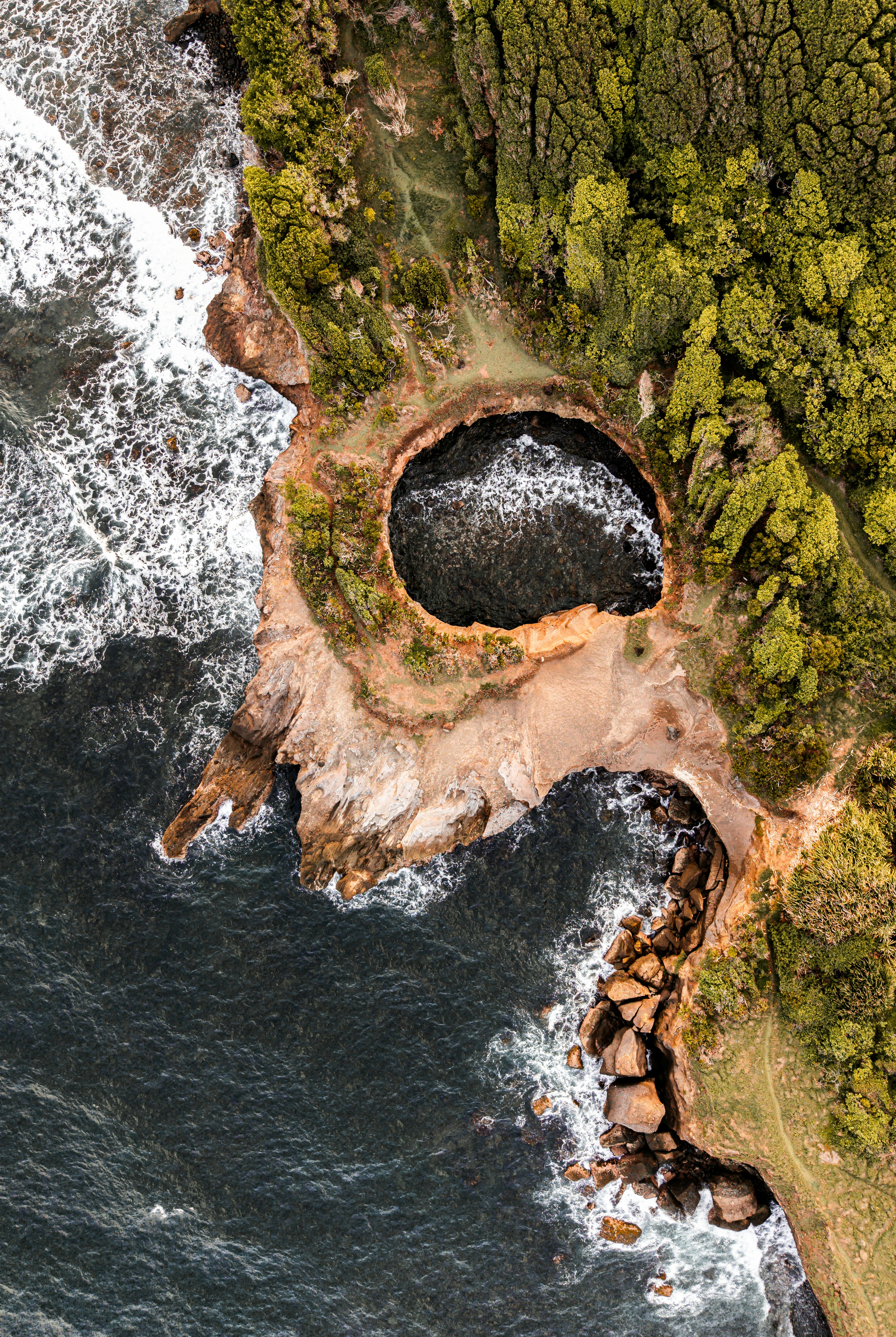 Circular Cove Carved by Waves: Aerial View of Coastal Ring and Tide Pool