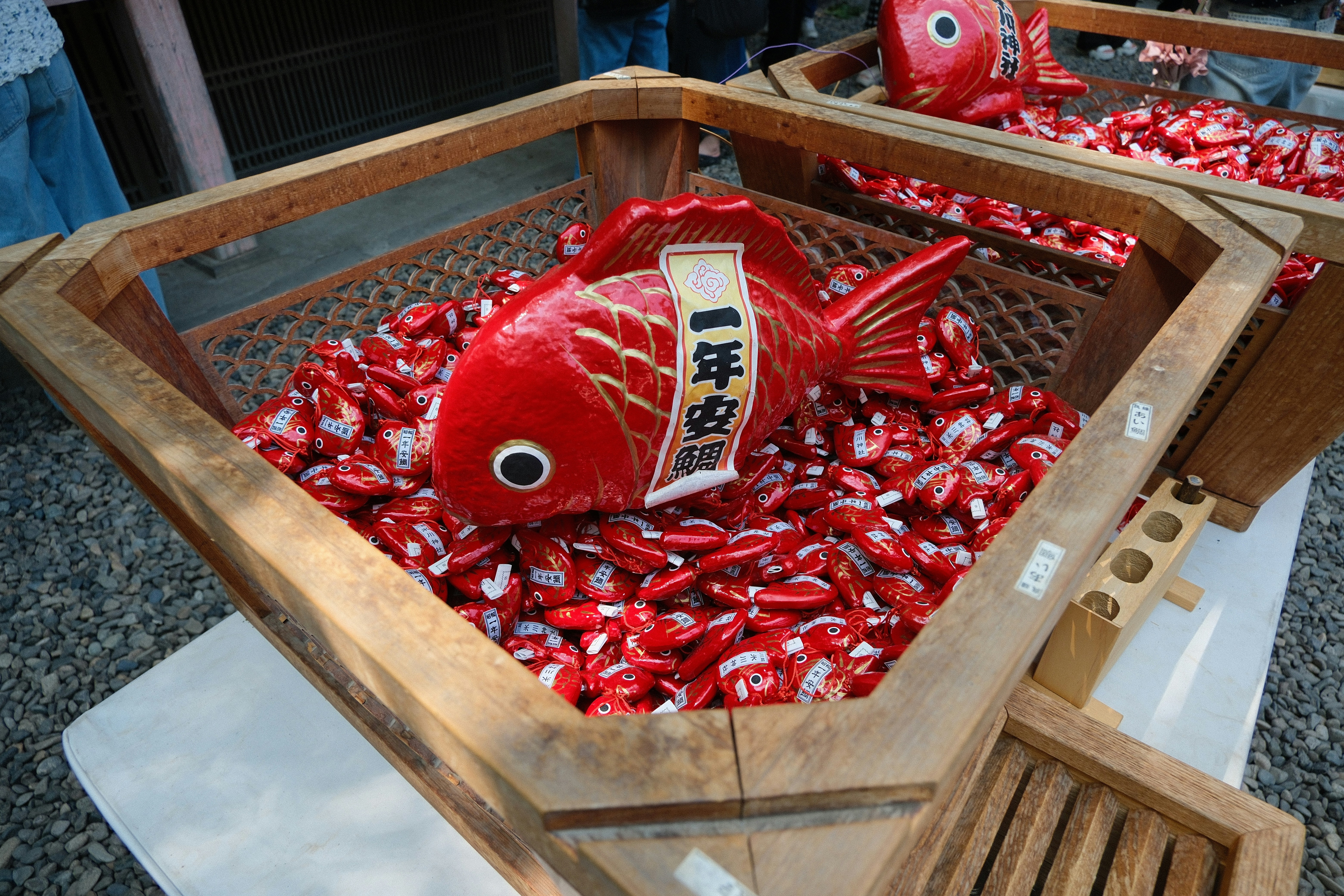 Festival Shrines: A Wooden Frame Surrounds Red-Faced Toy Lions in a Sea of Candy