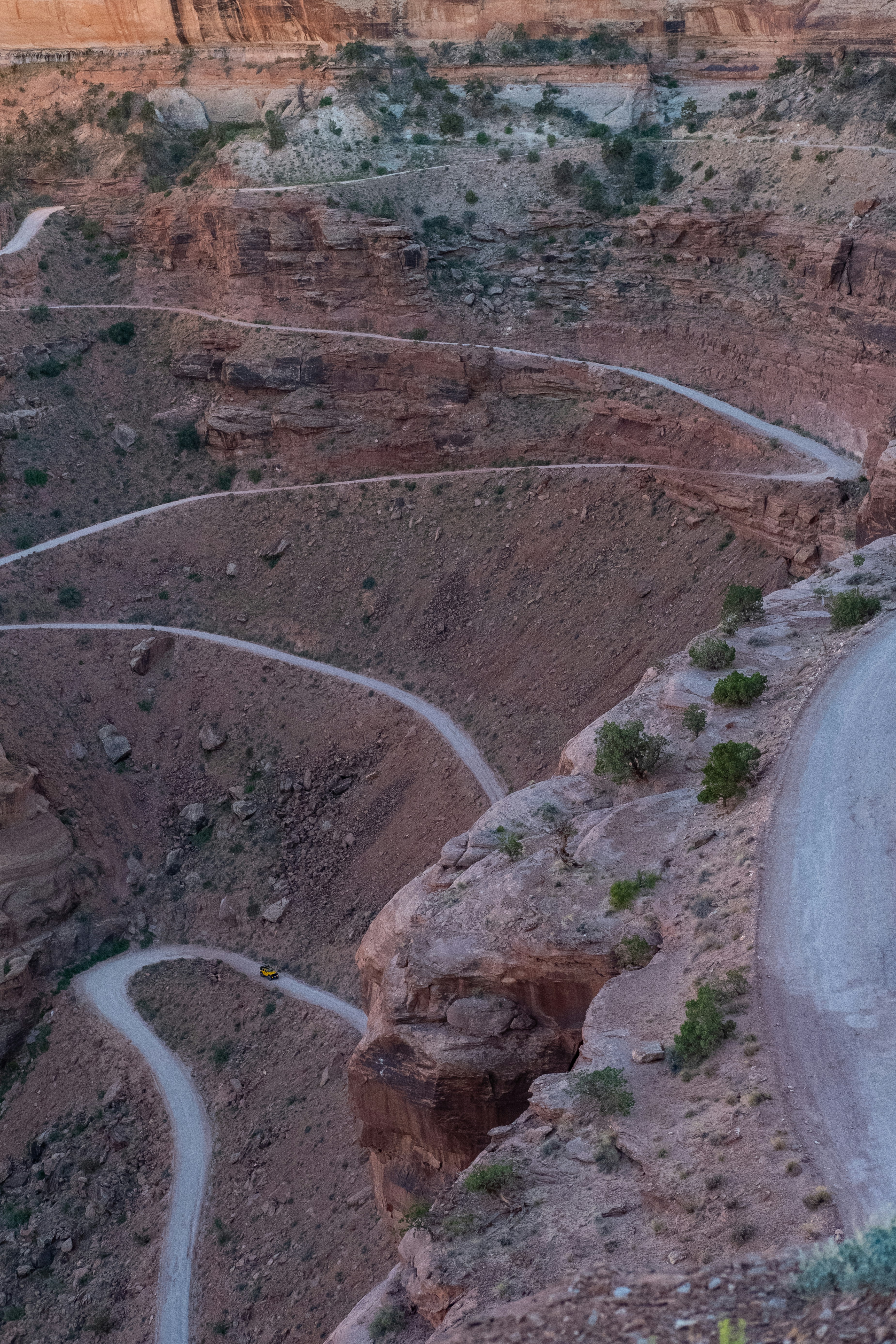 Meandering Cliff Road Winding Through Desert Terrains