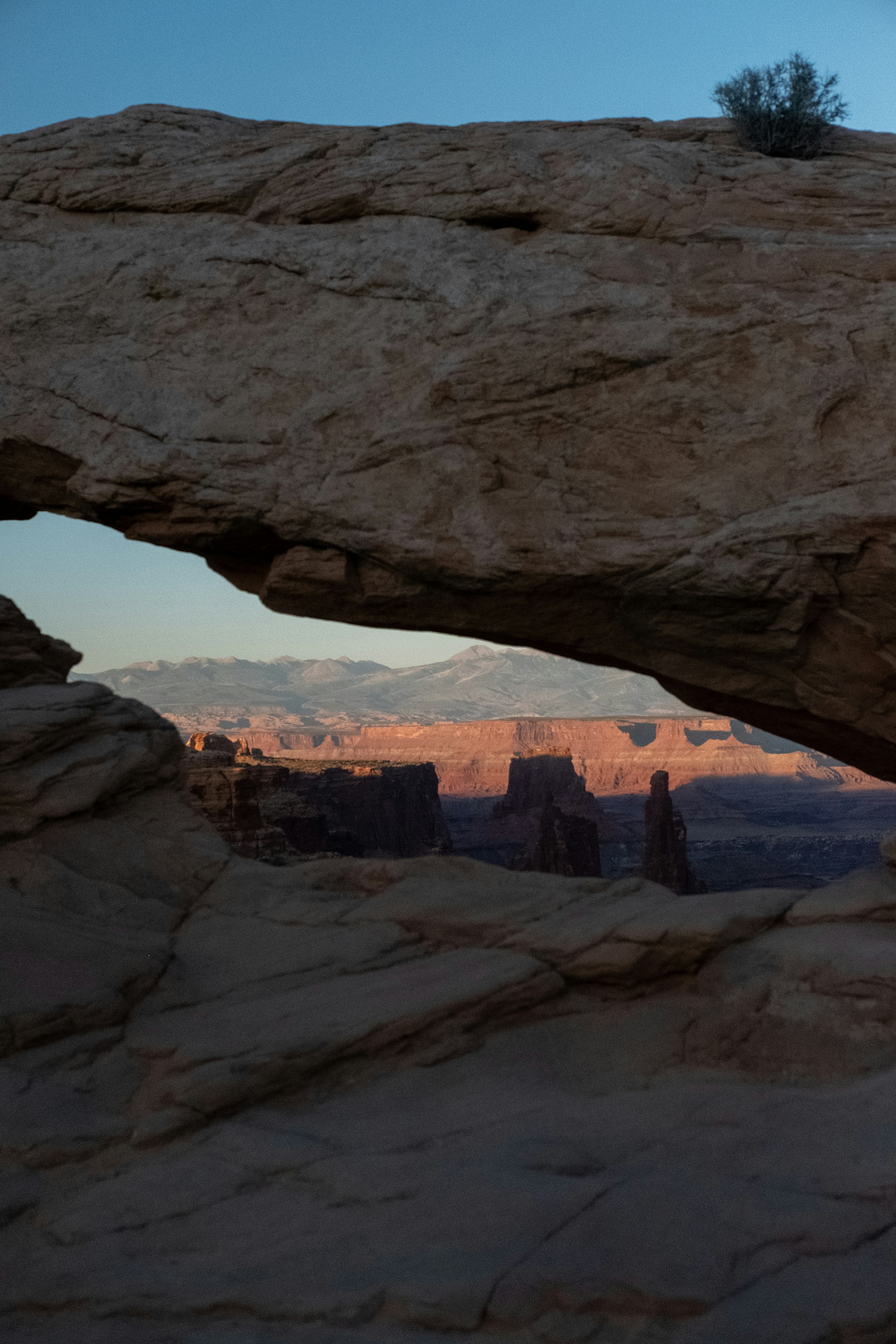 Natural Stone Window Framing a Canyon Sunset