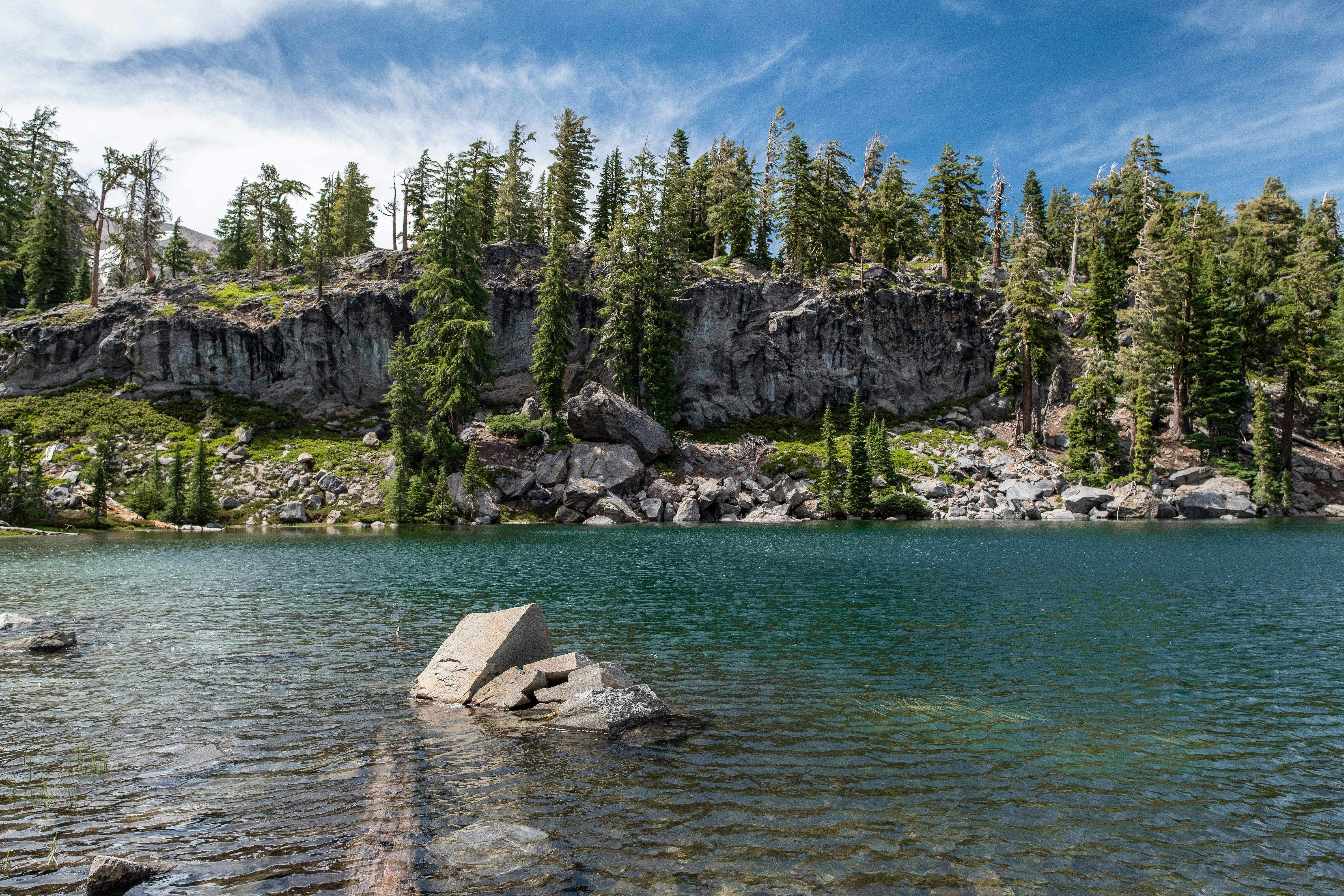 Ring of Granite and Pines: A Serene Mountain Lake