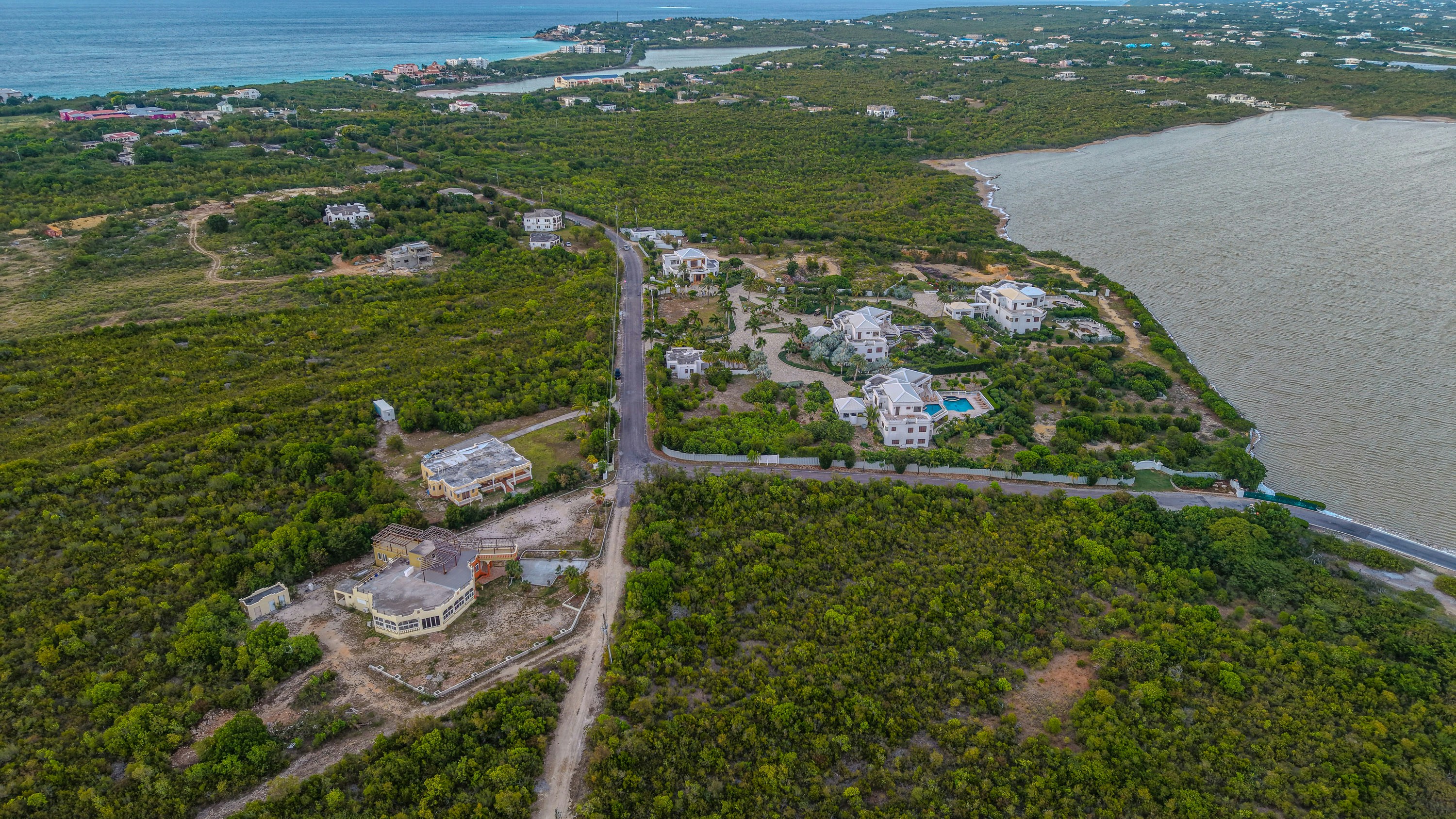 Aerial Gateways: Crescent Road Through Spring-Tide Coast