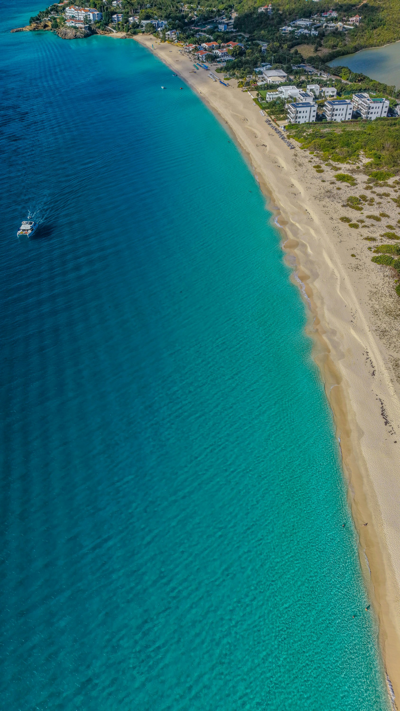 Emerald Slope: Aerial Whisper Along a Quiet Coastal Curve