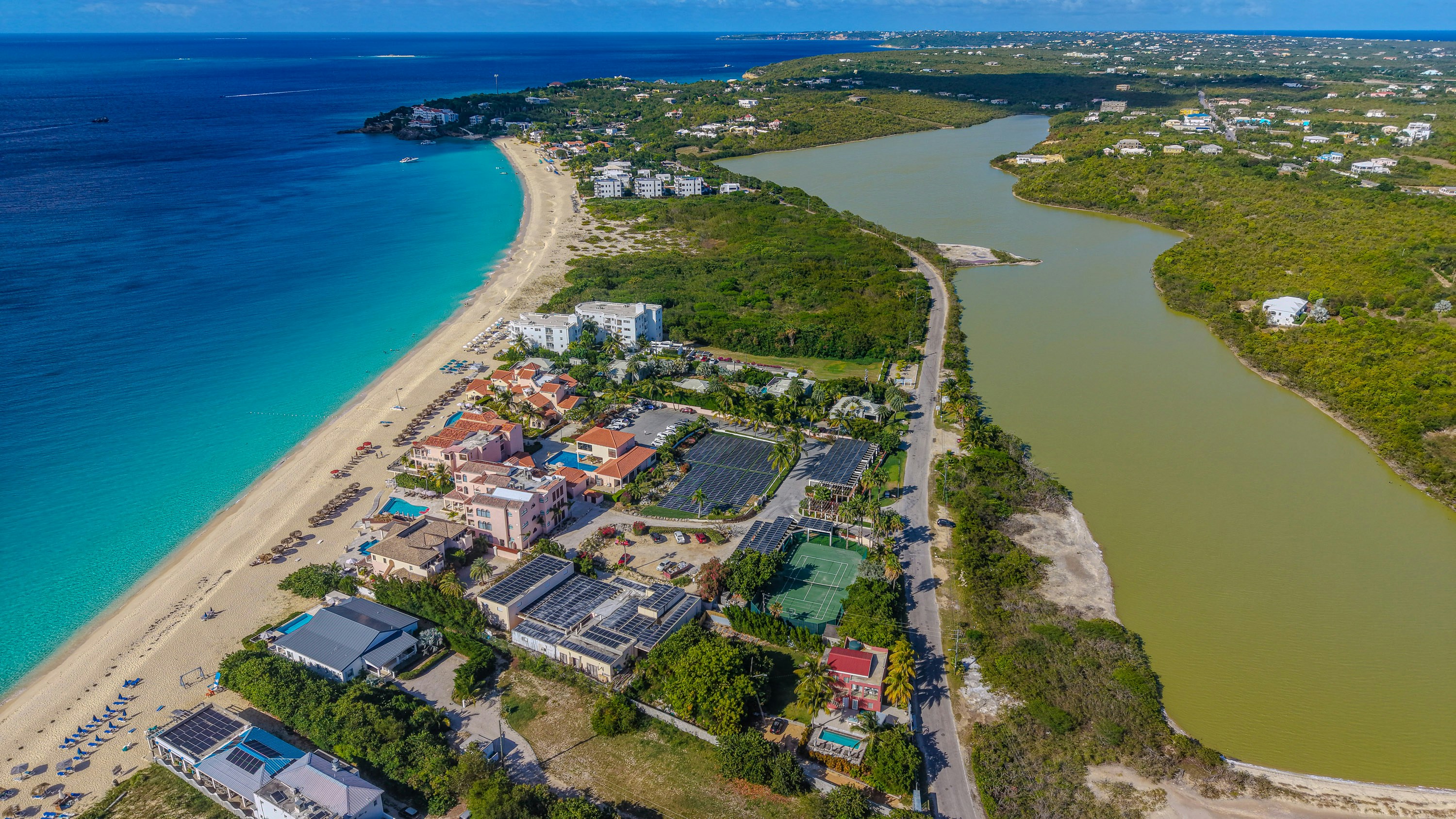 Coastal Village Fringed by Turquoise Sea and Meandering Estuary
