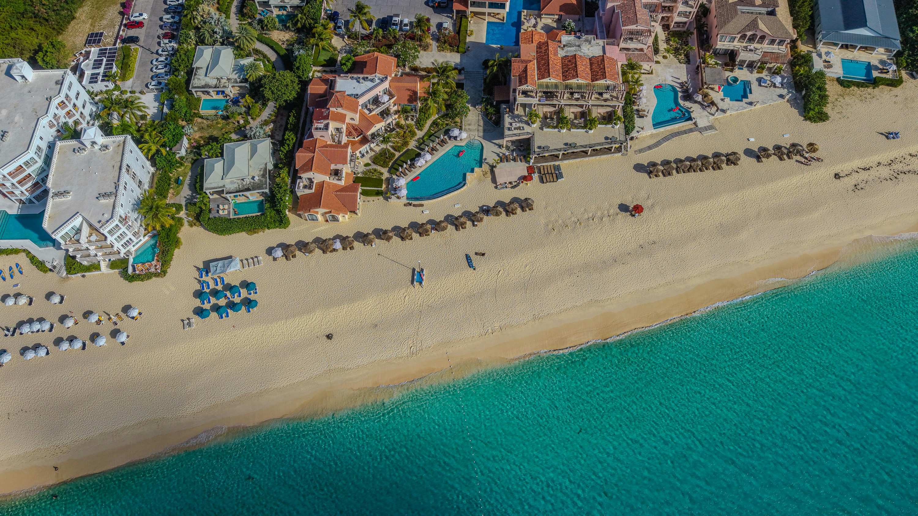 Seaside Village Stretch: Beachfront Homes and Turquoise Water