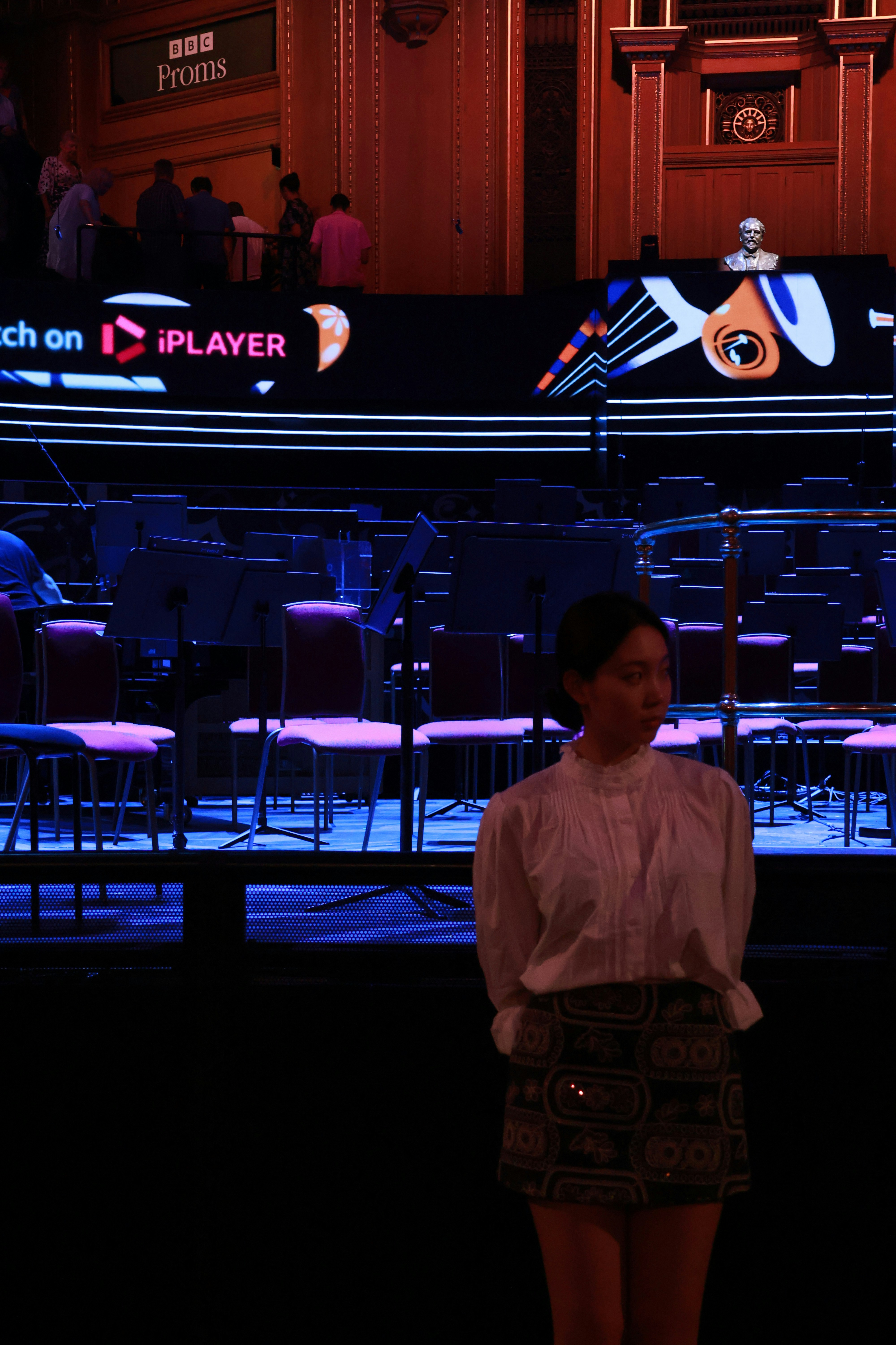 Stage Quiet: A lone performer in a dimly lit concert hall