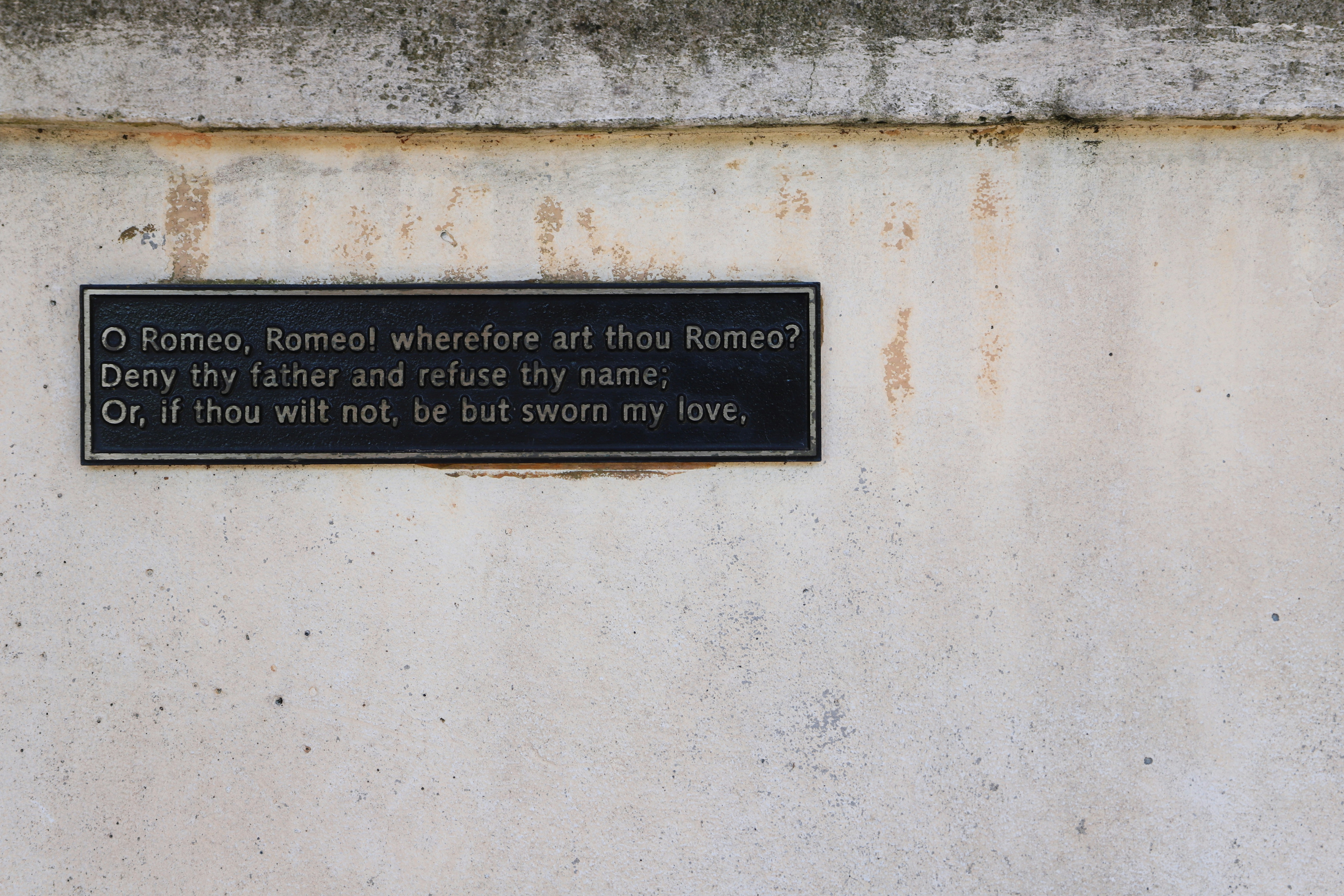 Inscribed Verse on Weathered Wall