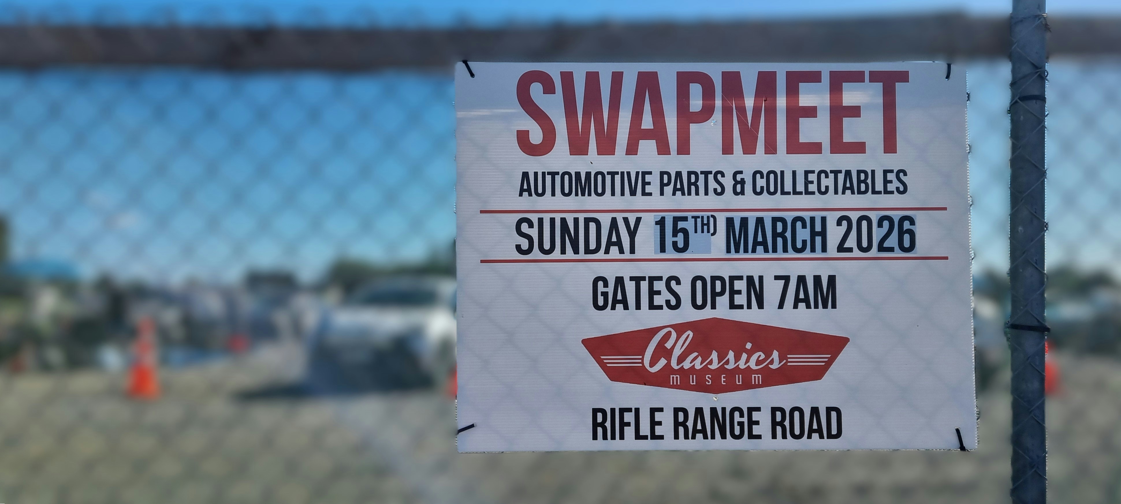 SwapMeet Sign at the Edge of the Fenced Lot