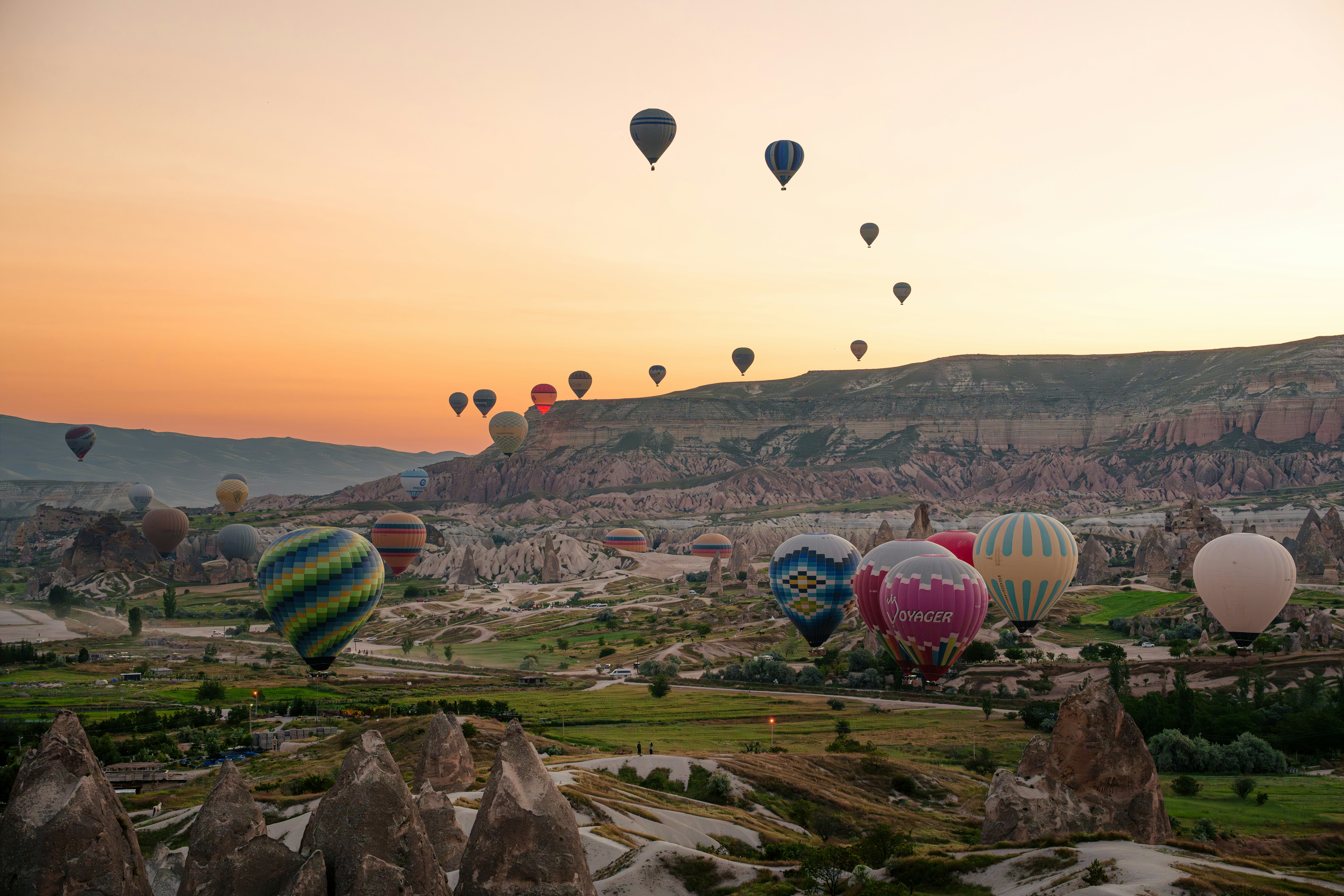 A Sea of Balloons over Cappadocian Valleys at Dawn