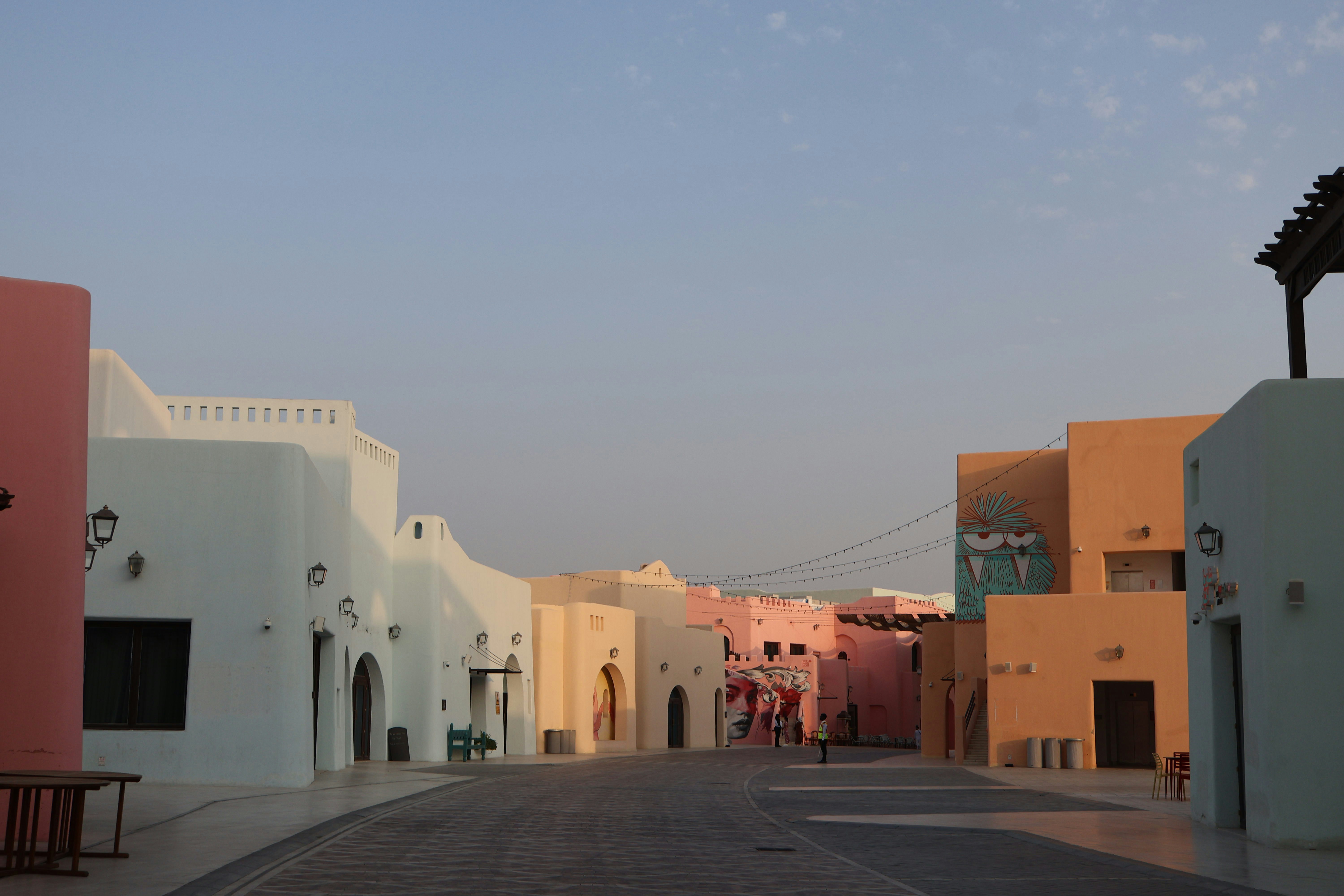 Pastel Alley: Quiet Street Through a Desert Village