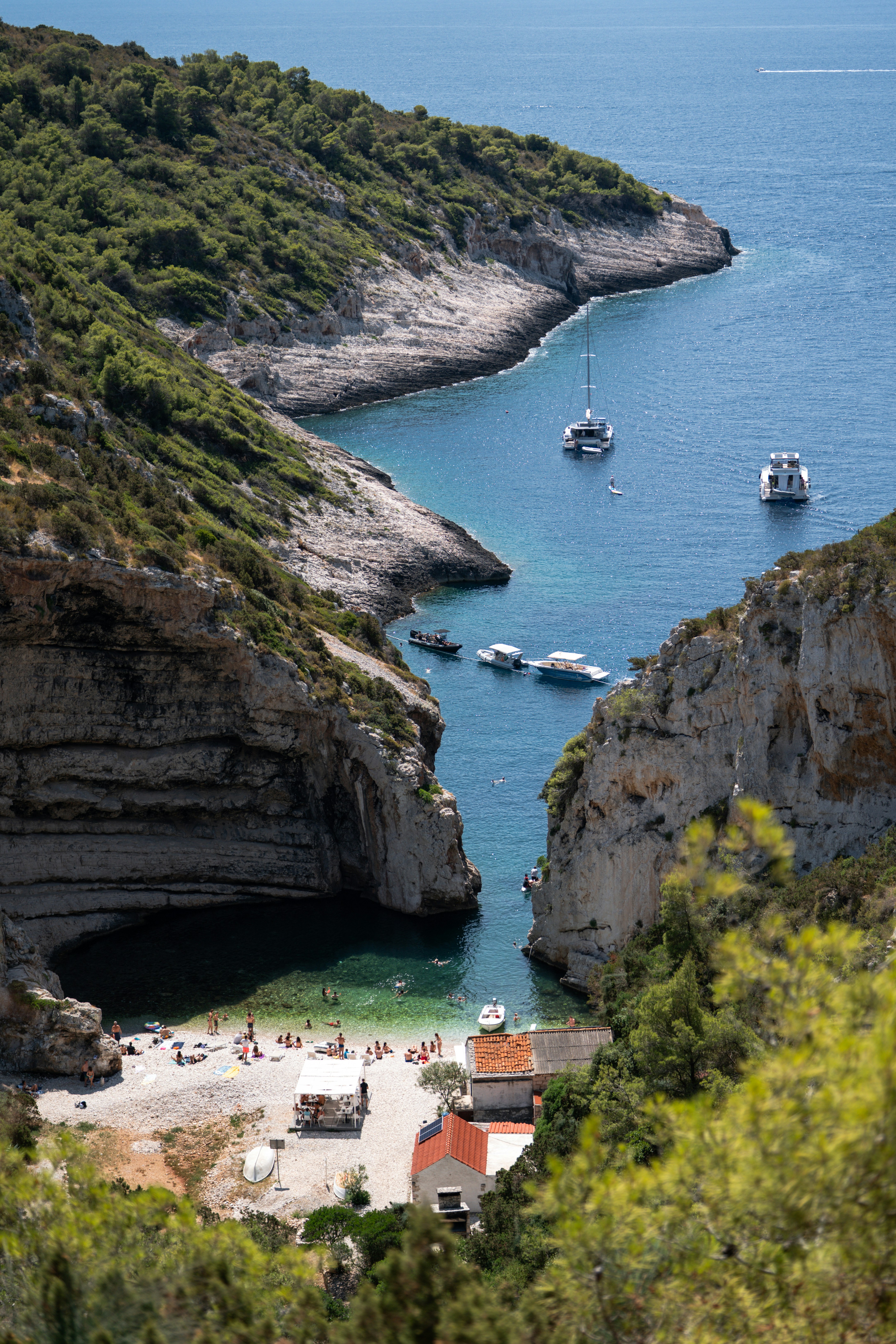 Cove of Boats Amid towering limestone cliffs