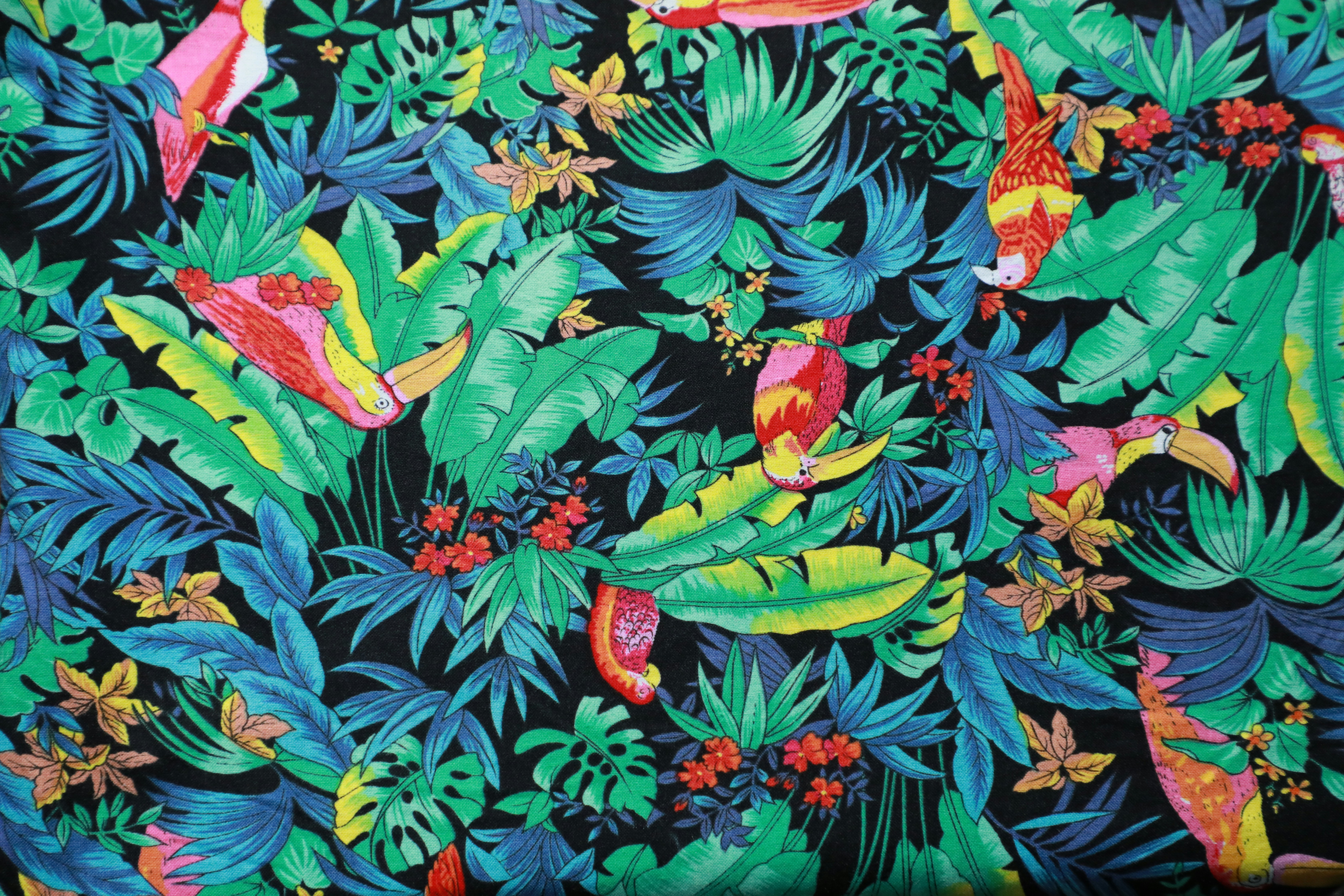 Tropical Tangle: Vivid Leaves and Parrots in a Midnight Jungle