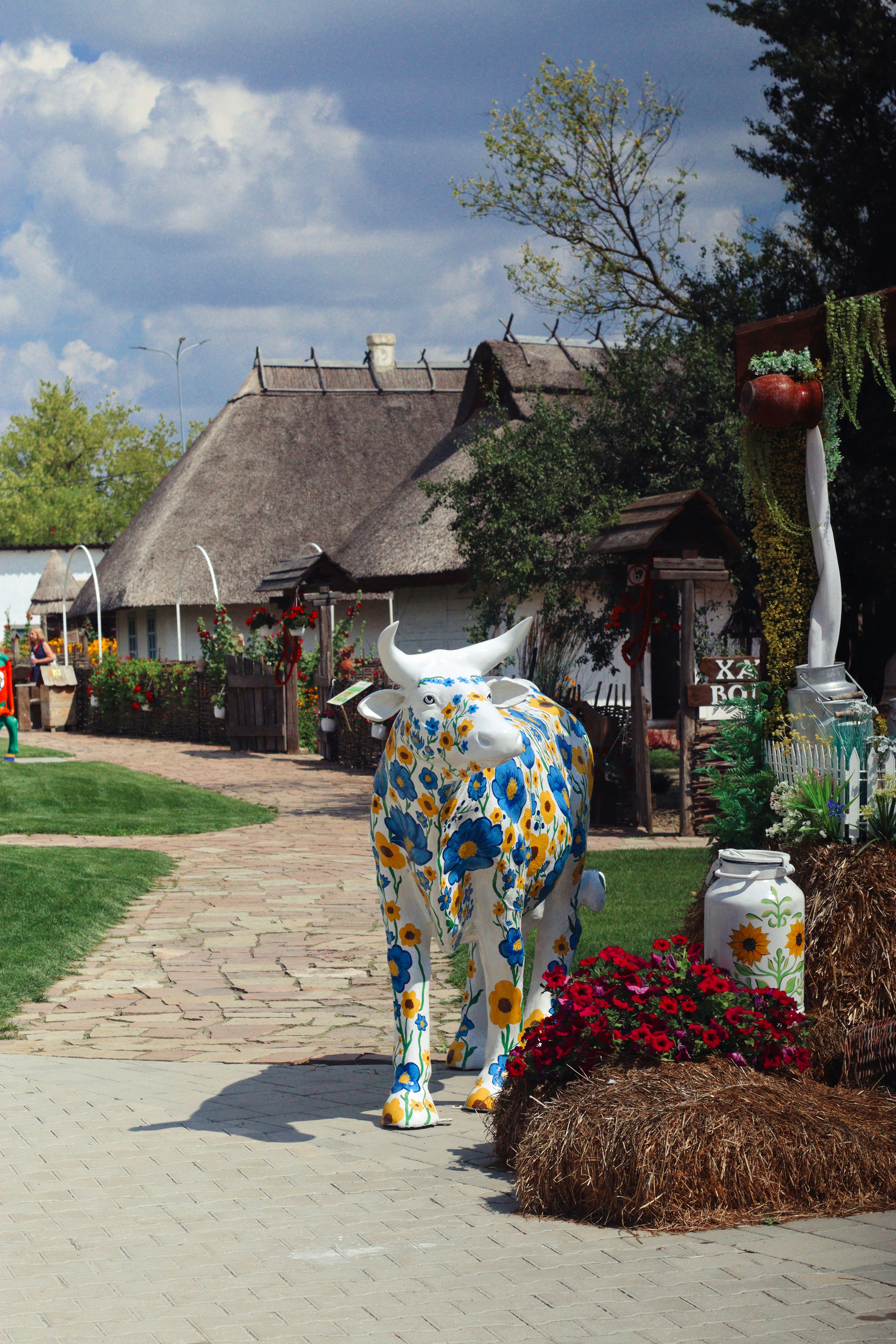 Sunflower-Pattern Bull Graces a Sunlit Village Path