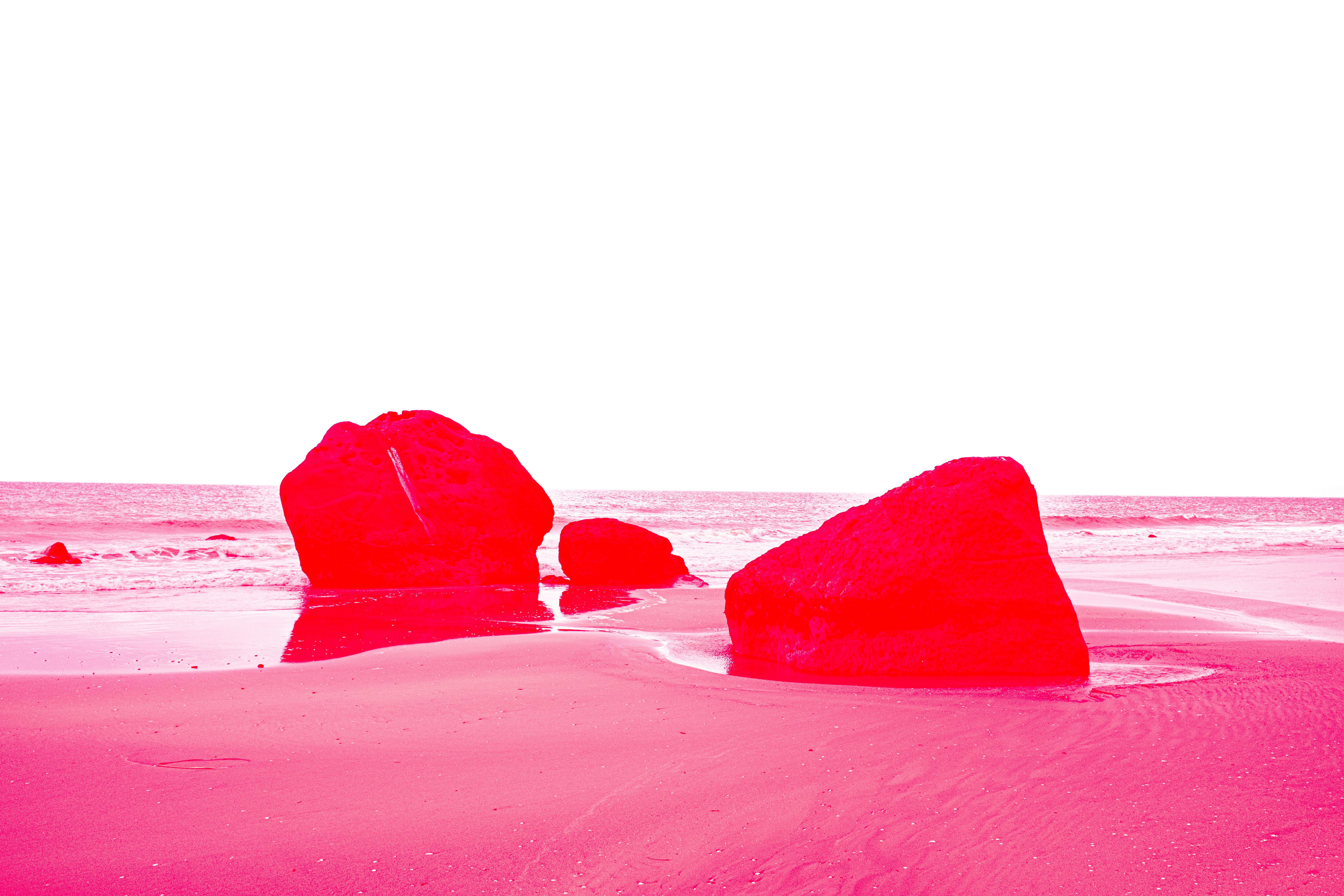Crimson Tide on Quiet Sands: Two Red Boulders at Dusk