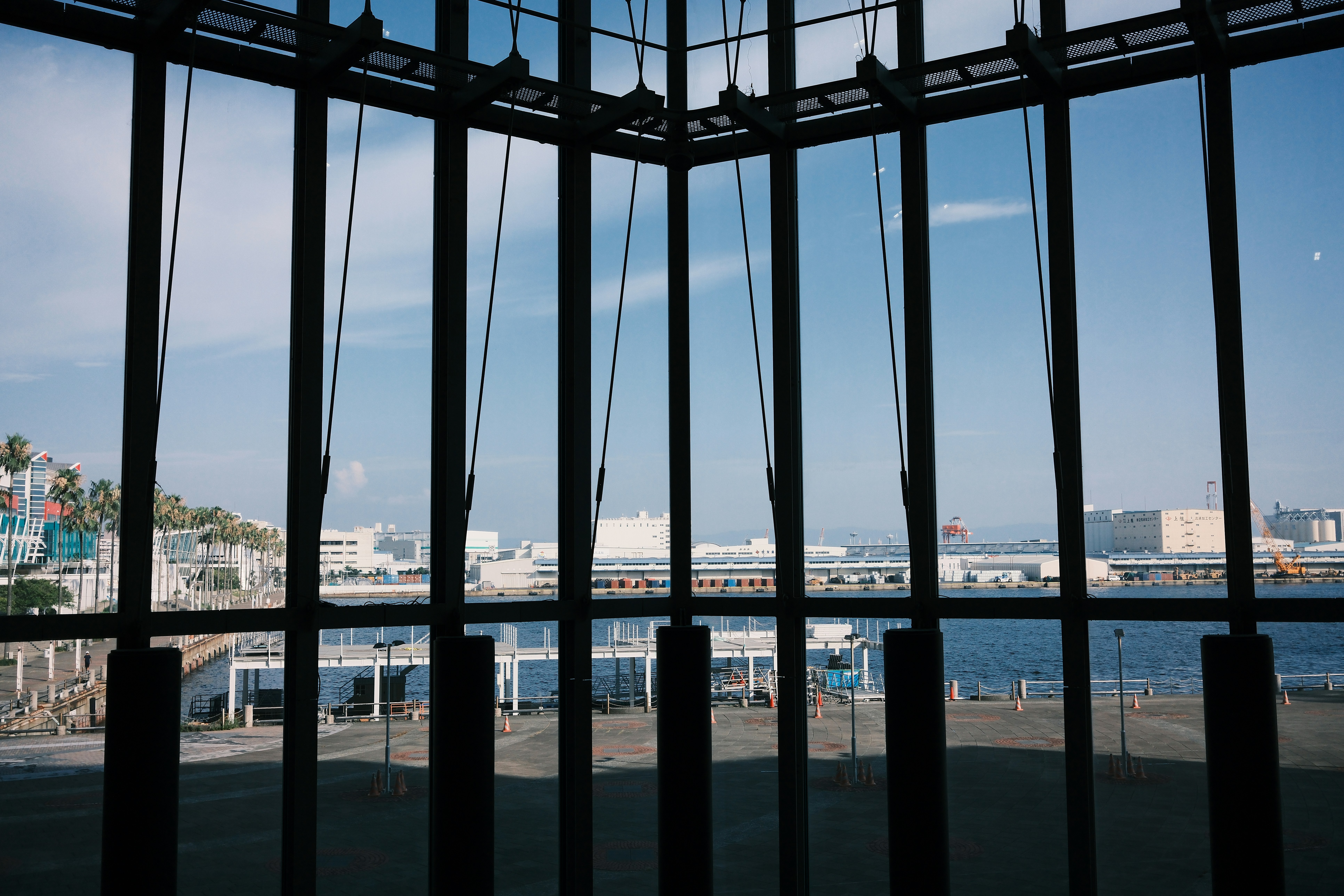 Framing the Harbor: Light Through the Vertical Bars
