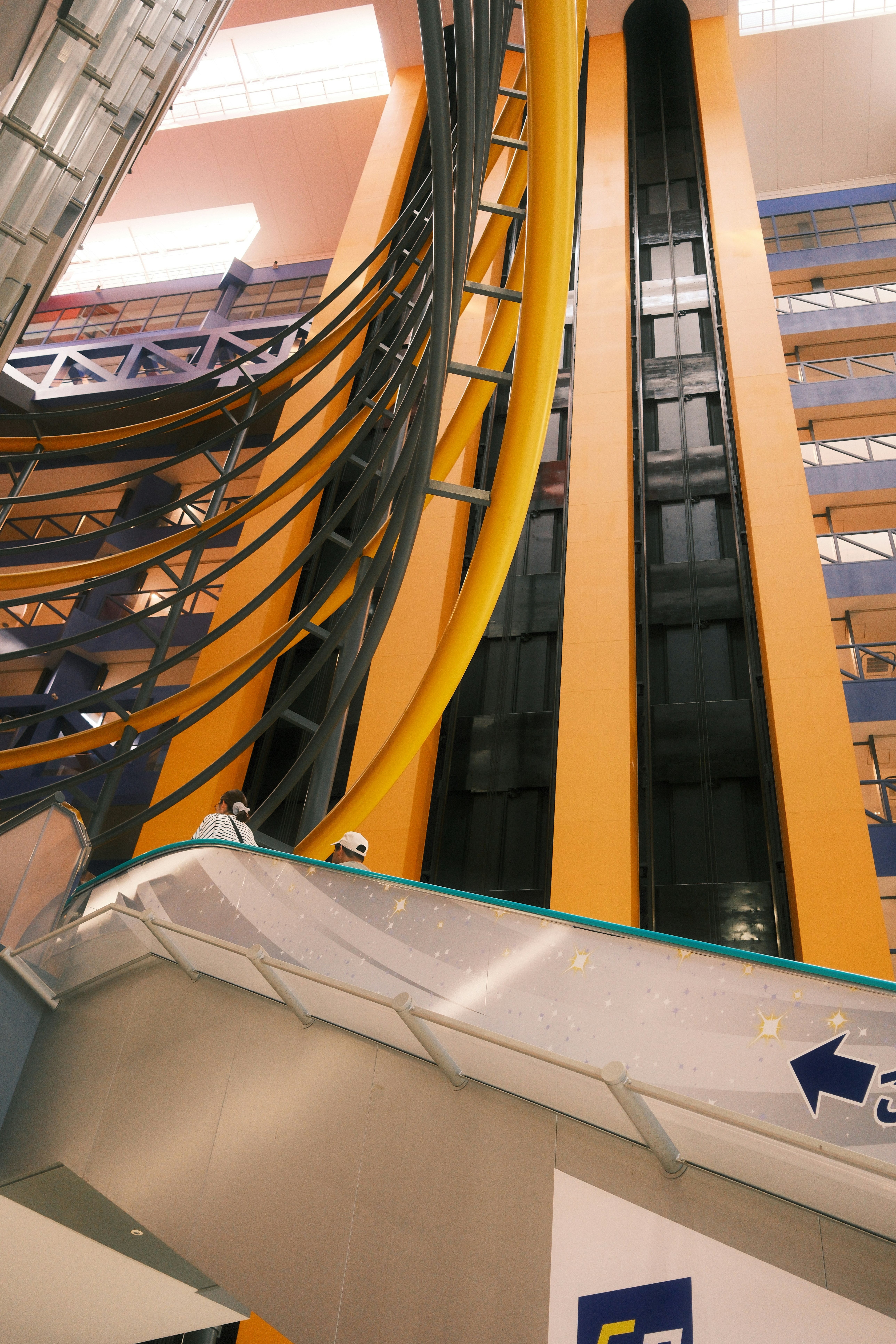 Industrial Atrium Spirals: Aerial Arcs of Color