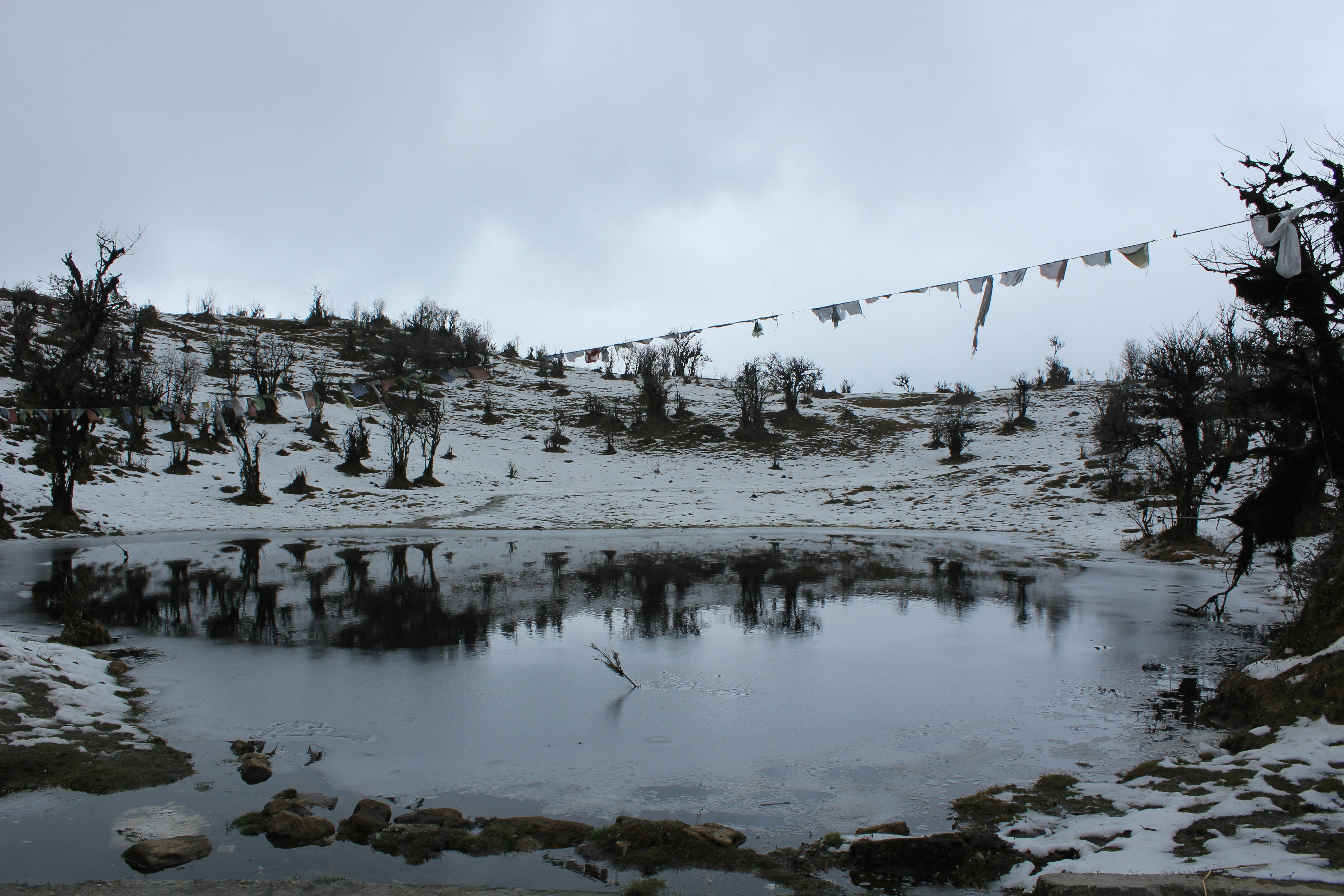 Snow-Kissed Basin Under Banner Flags
