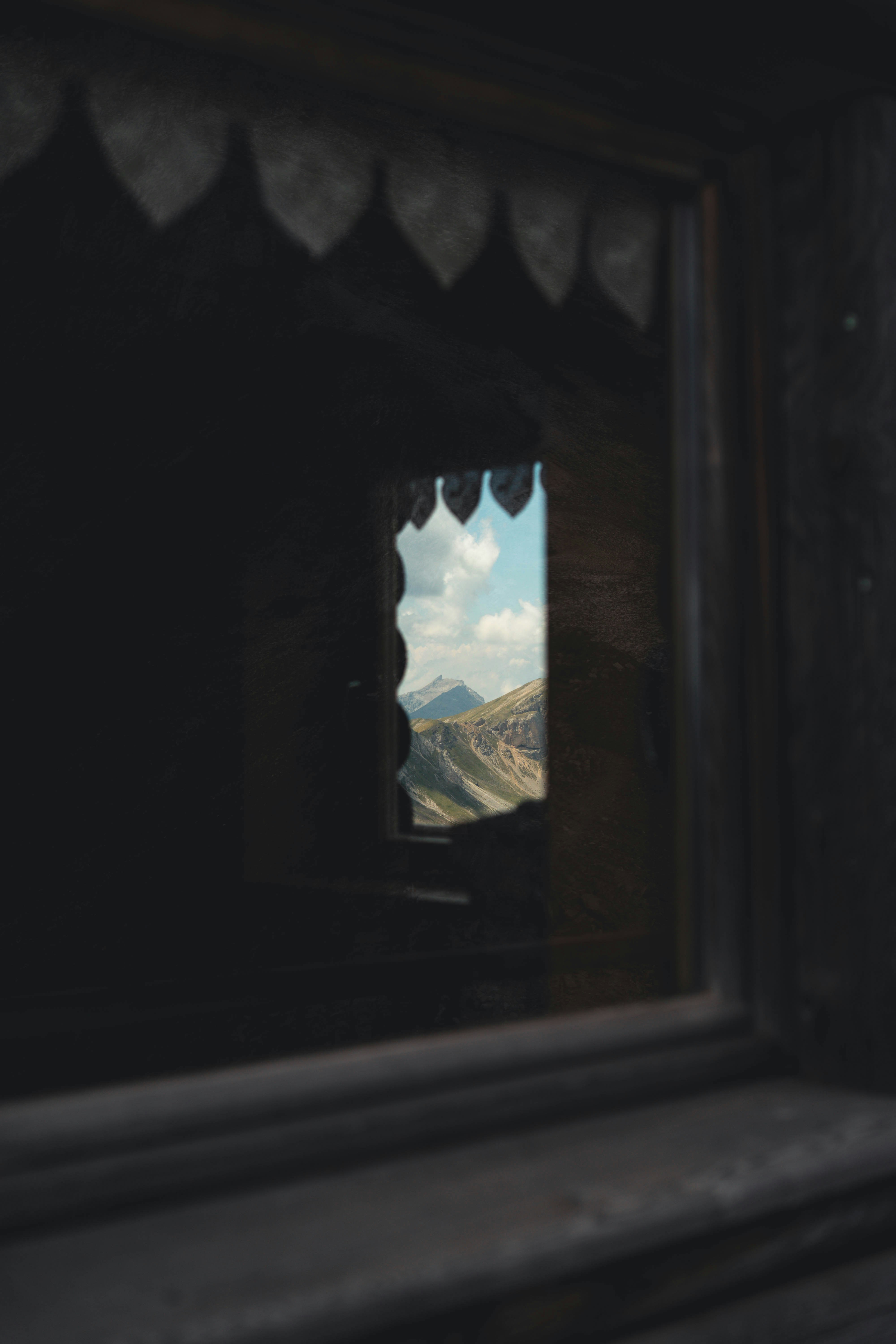 Through a Narrow Window to the Mountain Road