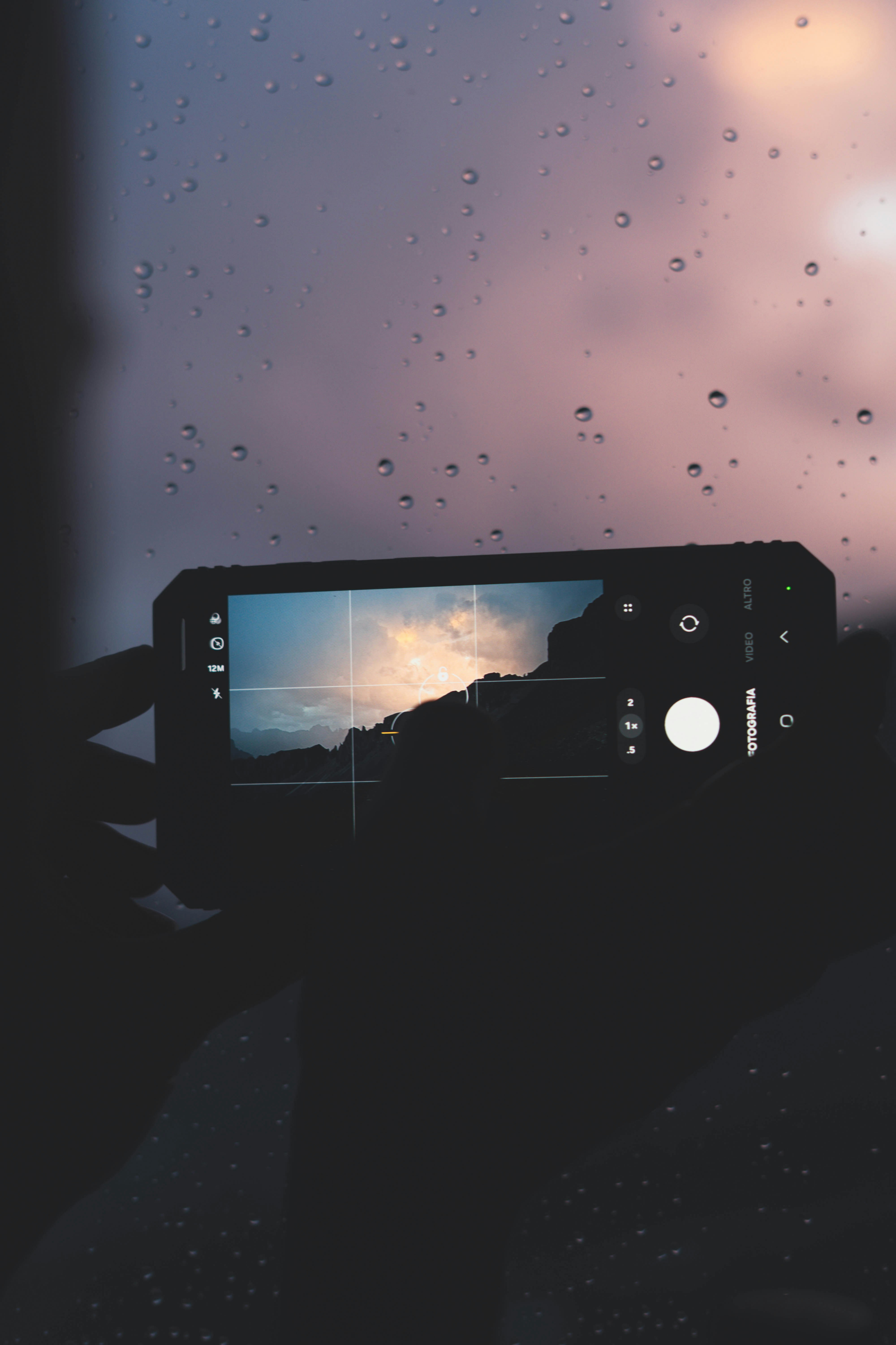 Lens of Rain: A Quiet Moment with a Smartphone Horizon