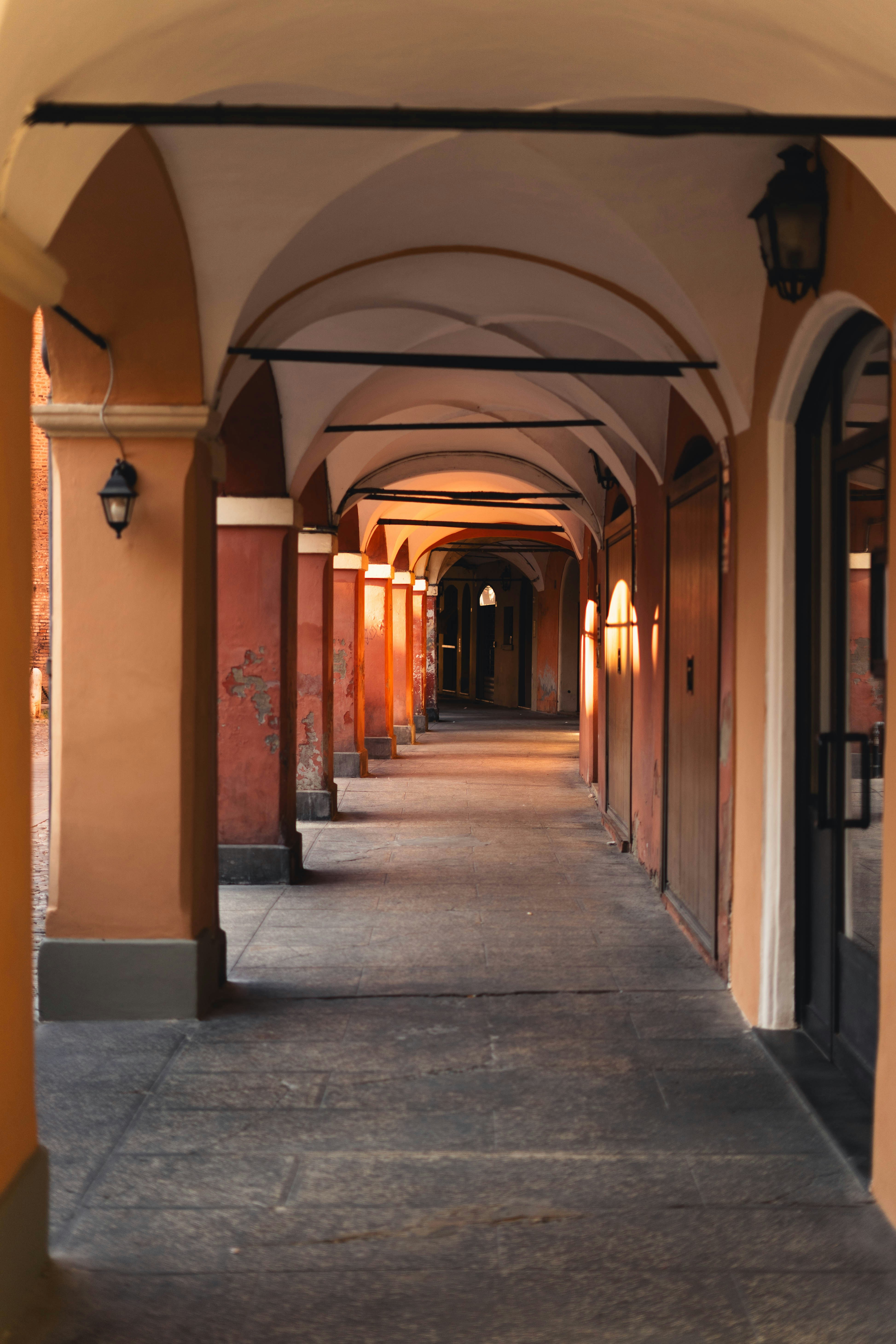 Warm Corridor of Arches: Vanishing Light Through Colonnade