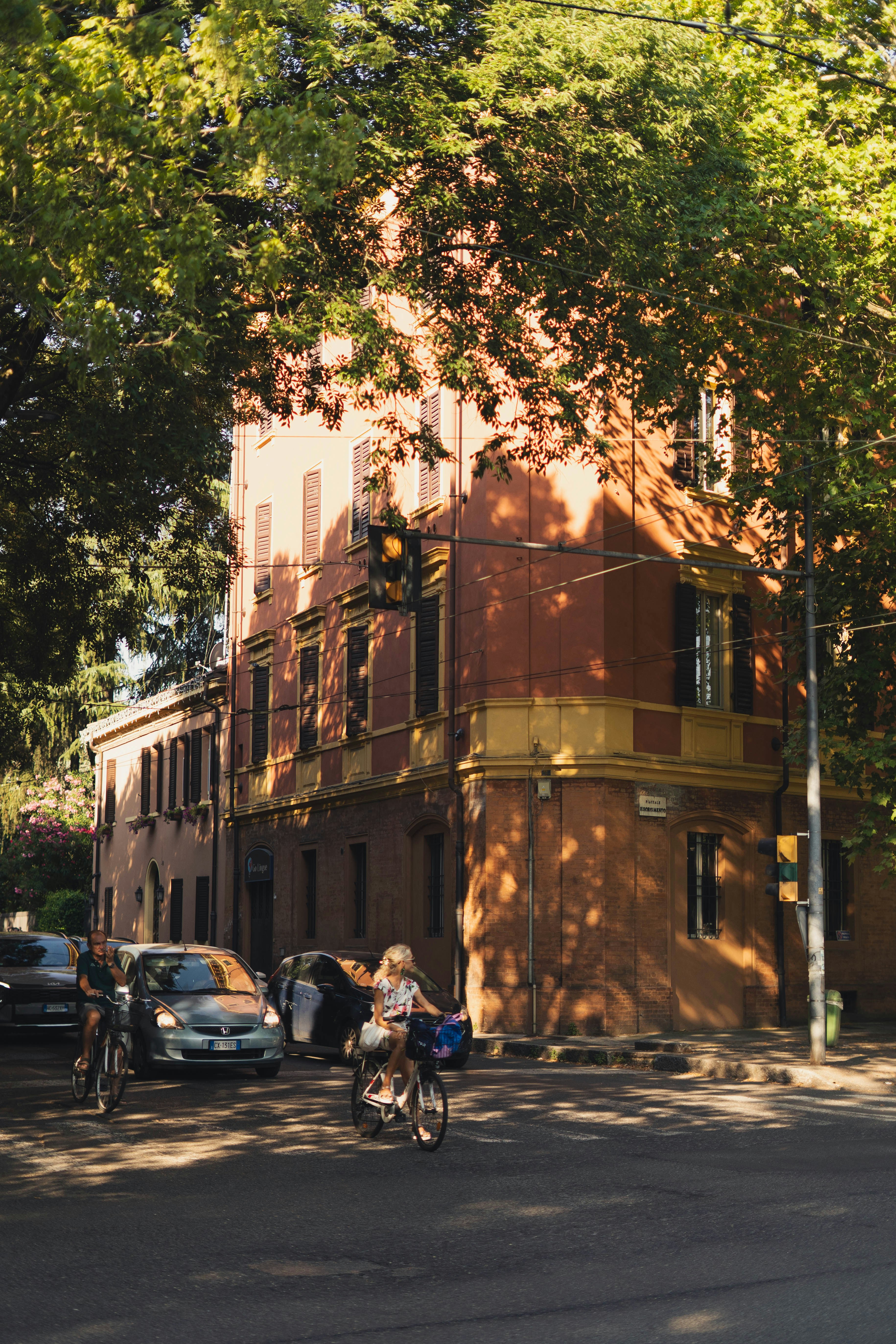 Bikes and Shadows on a Sunlit City Corner