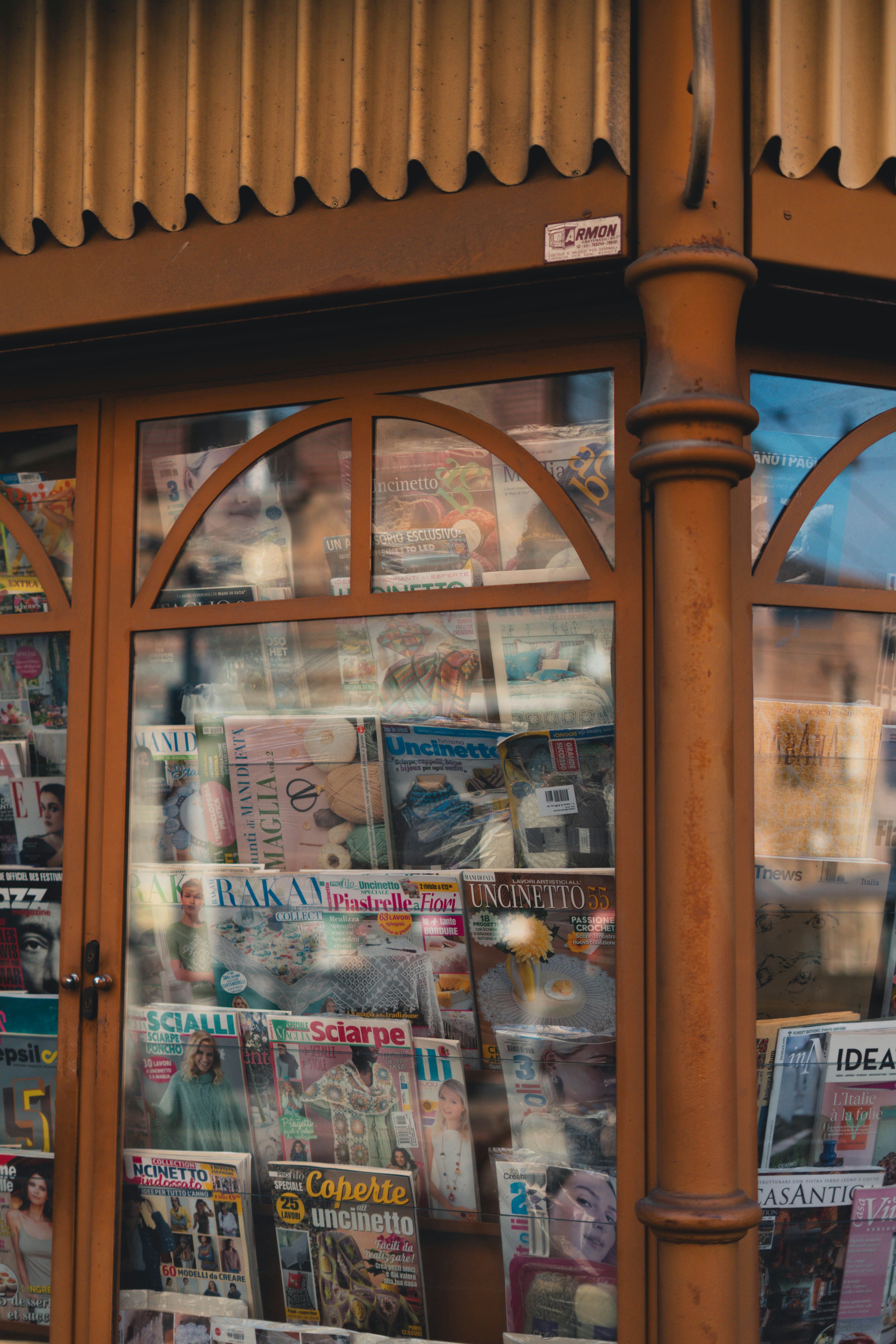 Cascading magazine Display Through Antique Bronze Windows