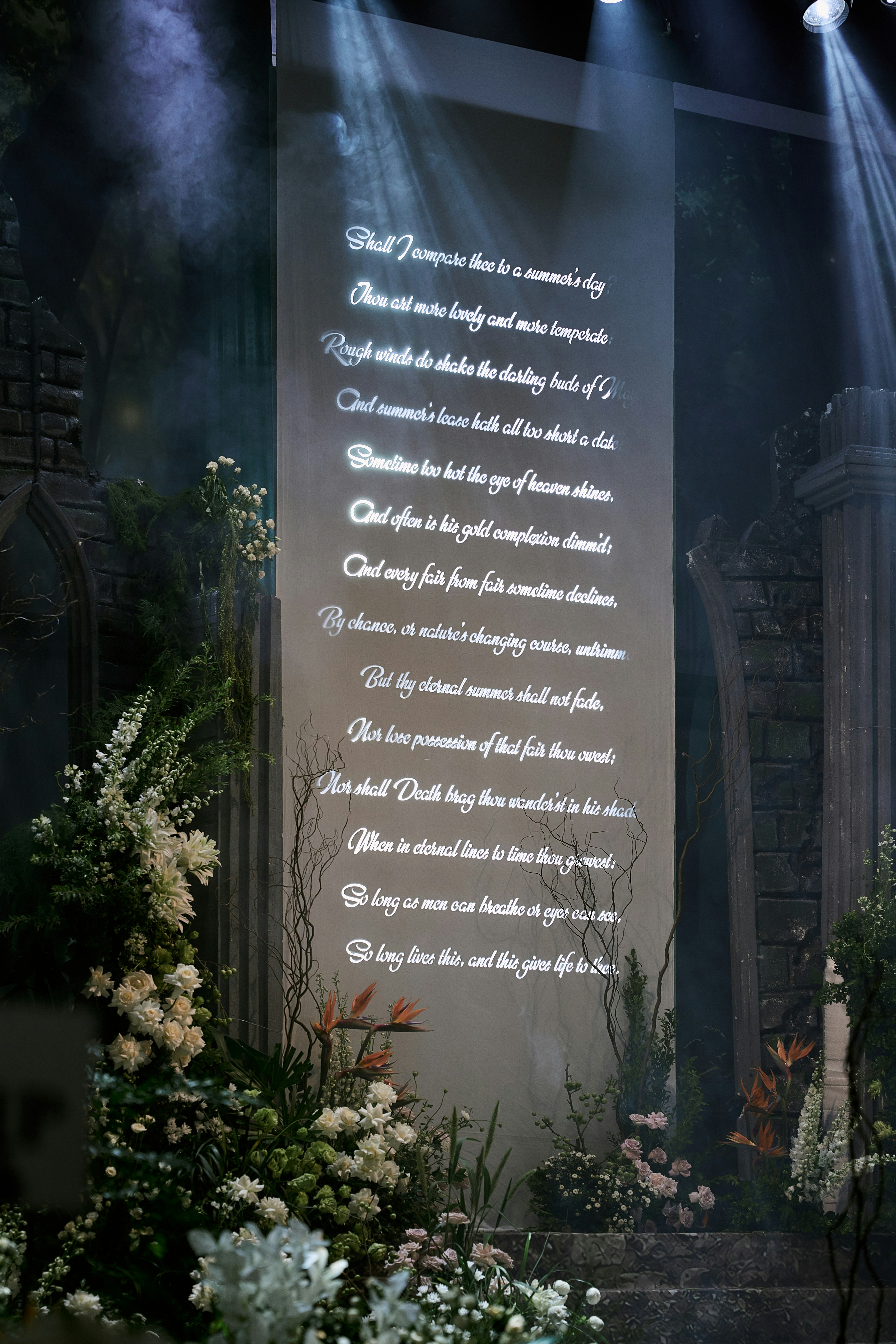 Vertical Poetry: A Lantern of Script amid Florals and Stone