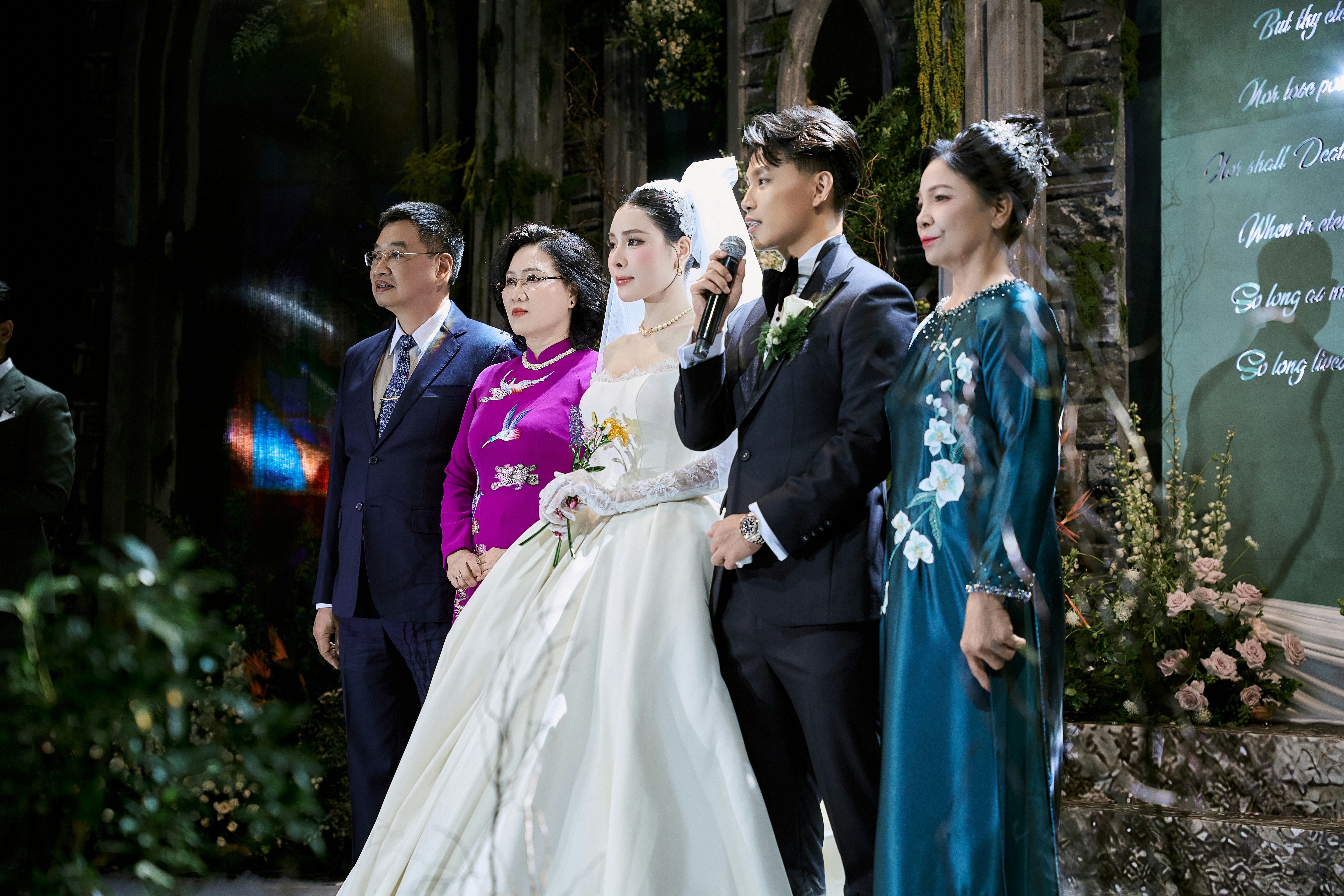 Bride and Groom Lead a Multigenerational Wedding Toast on a Lush Ceremony Set