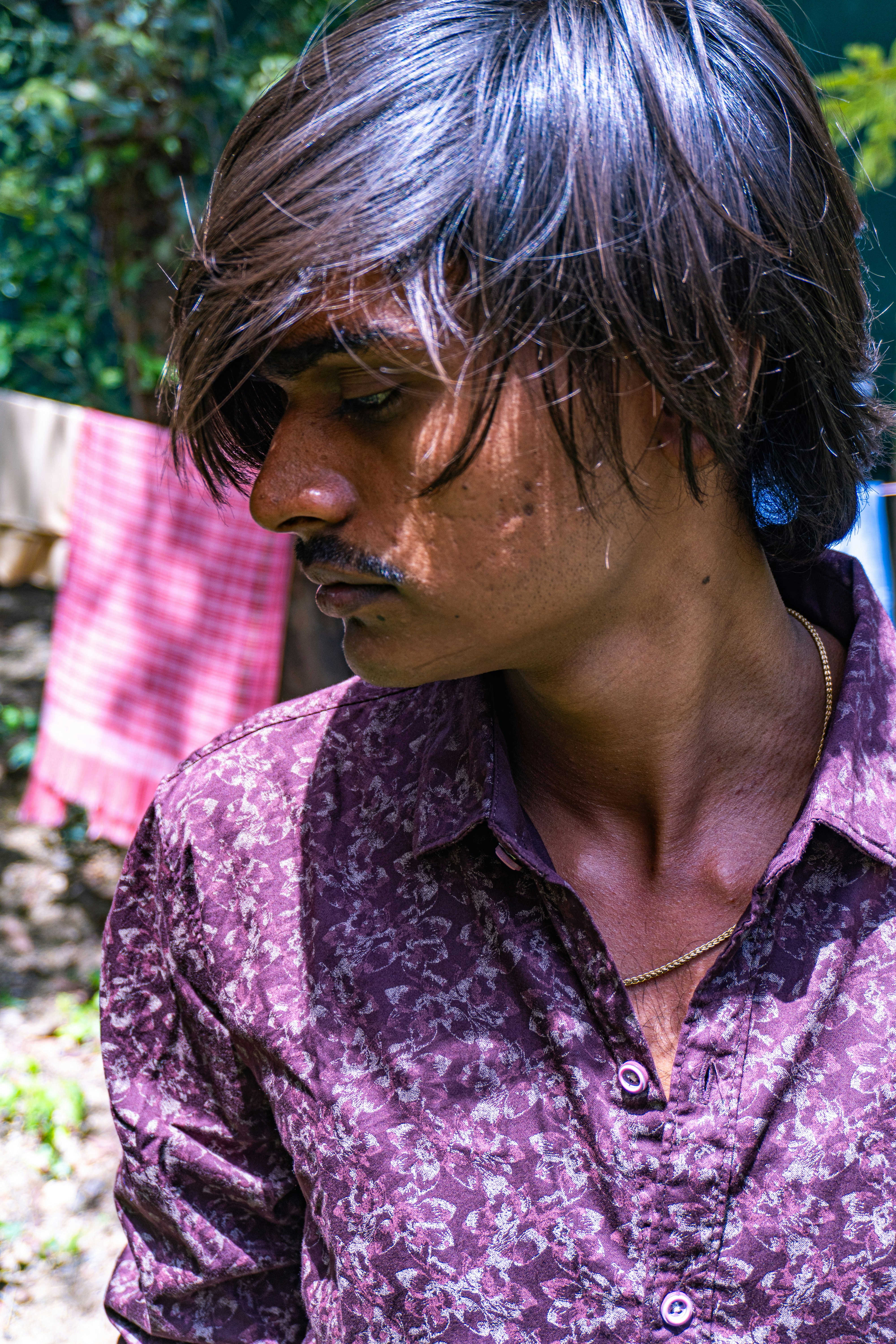 Portrait in Sunlit Streaks: A Quiet Contemplation in Purple Linen