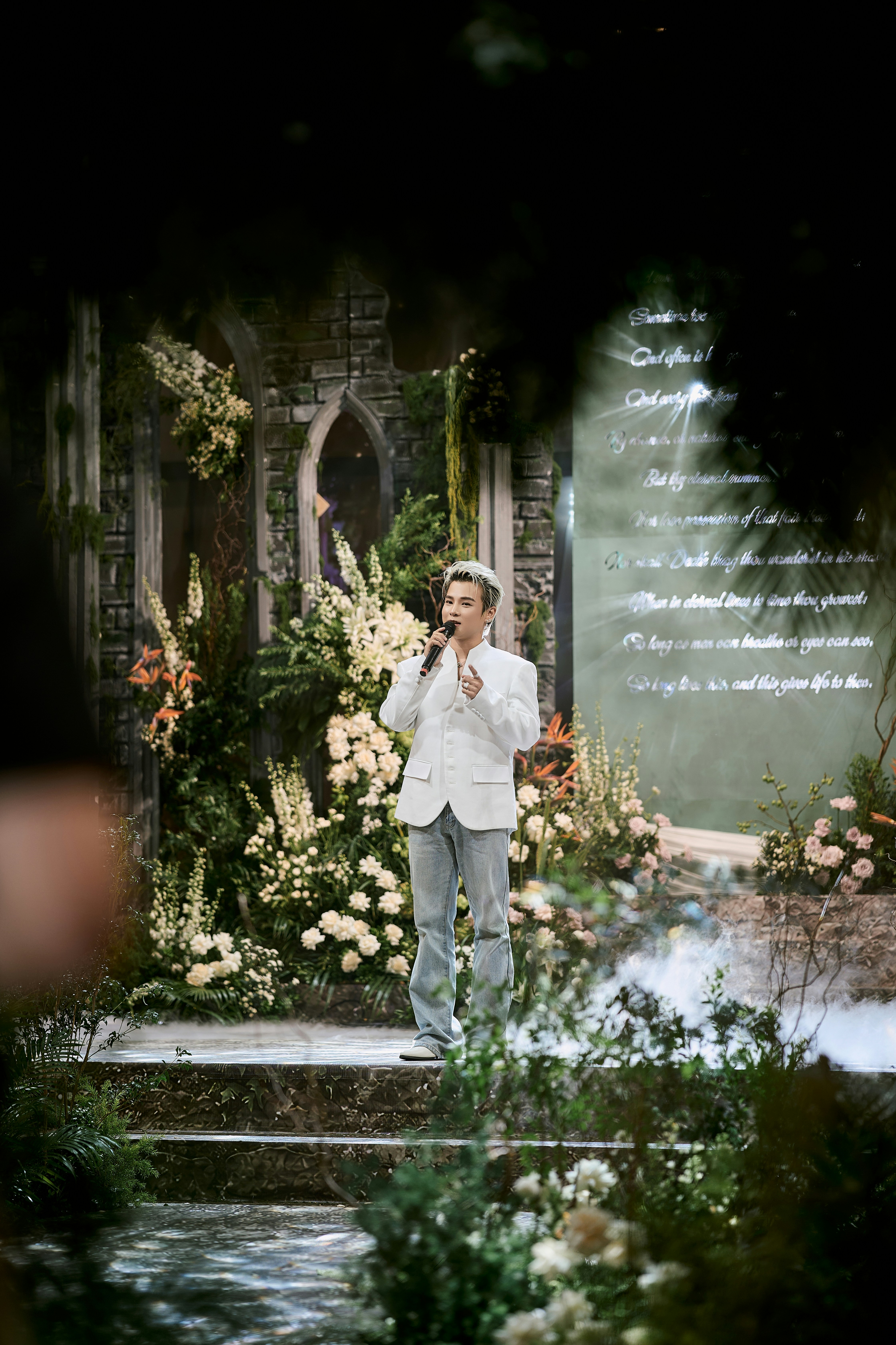 Spotlight Serenade: A Groom's Moment Amid Floral Heritage