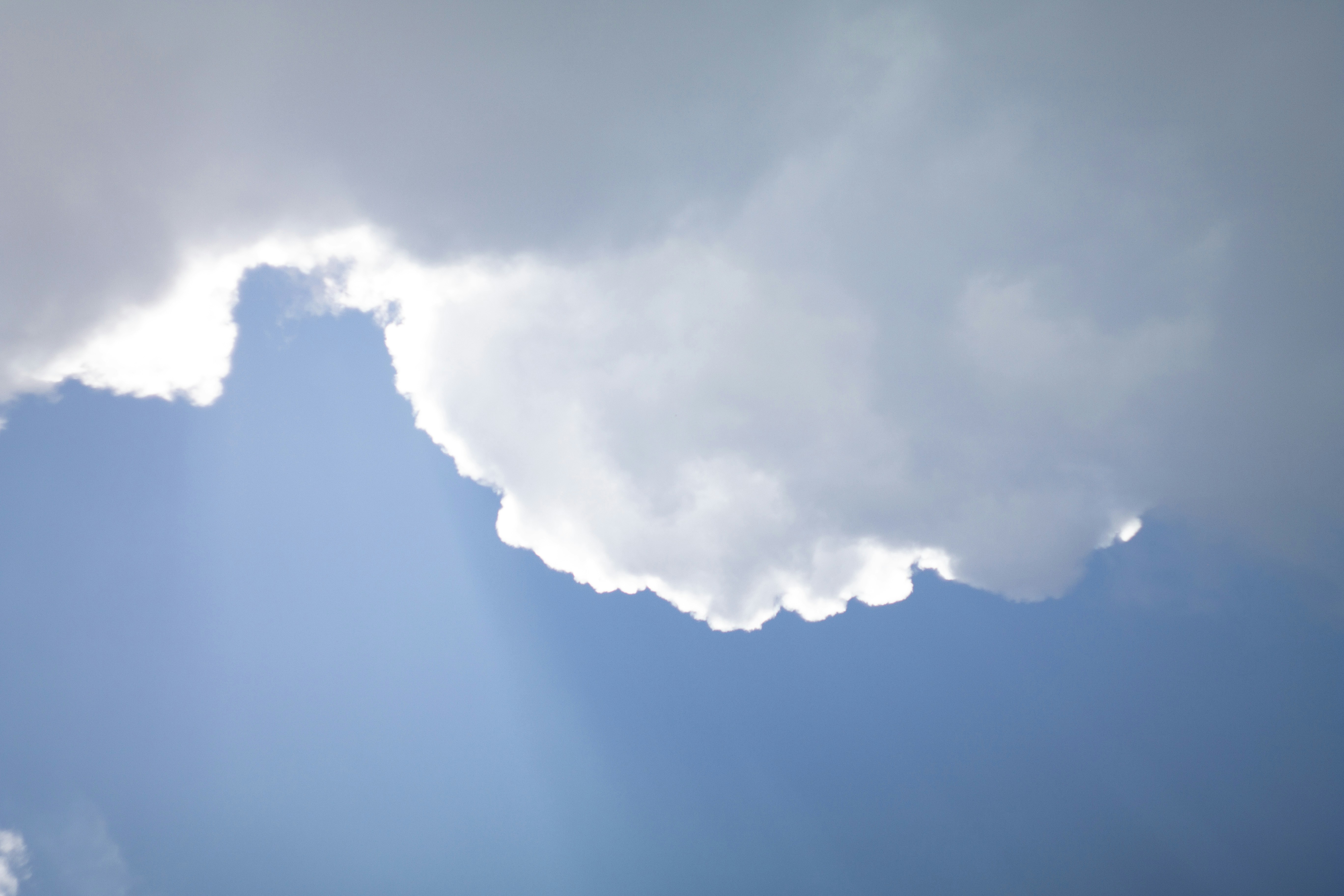 Sunlit Break in the Sky: A Cloud Edge with Beams of Light