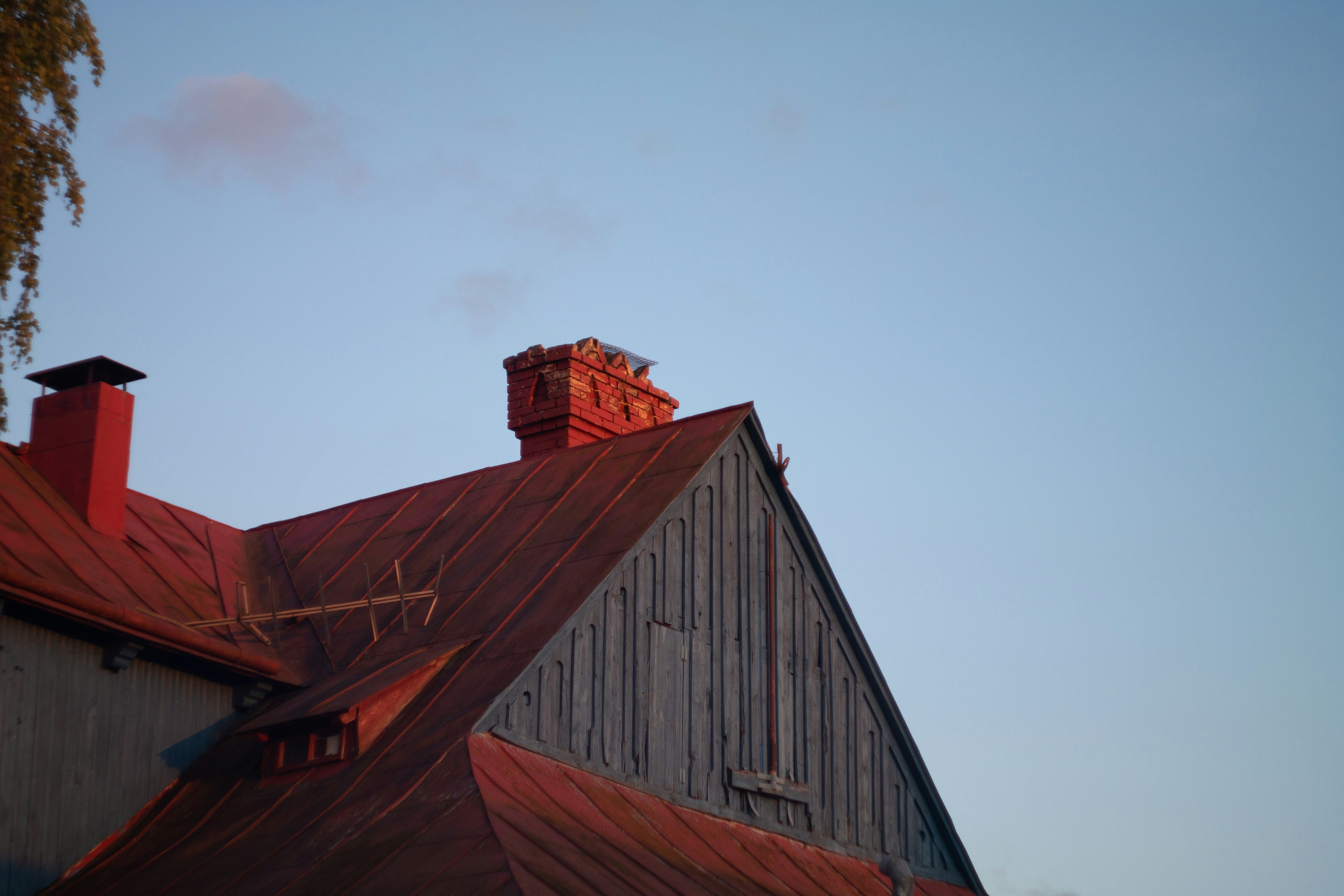 Sunlit Rooflines: A Quiet Barn Facade at Dusk