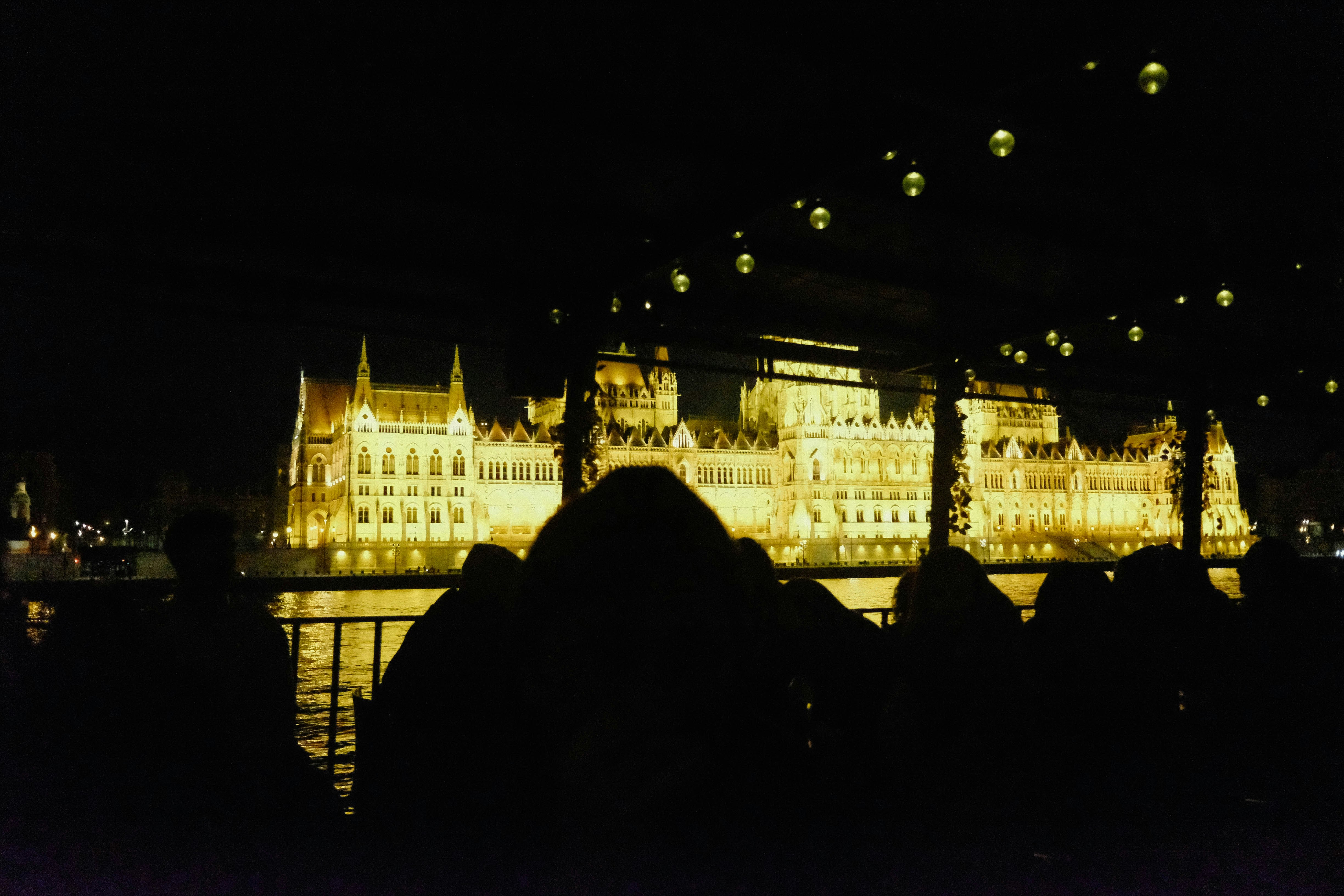 Golden Riverscape: Nighttime Shadows by the Parliament