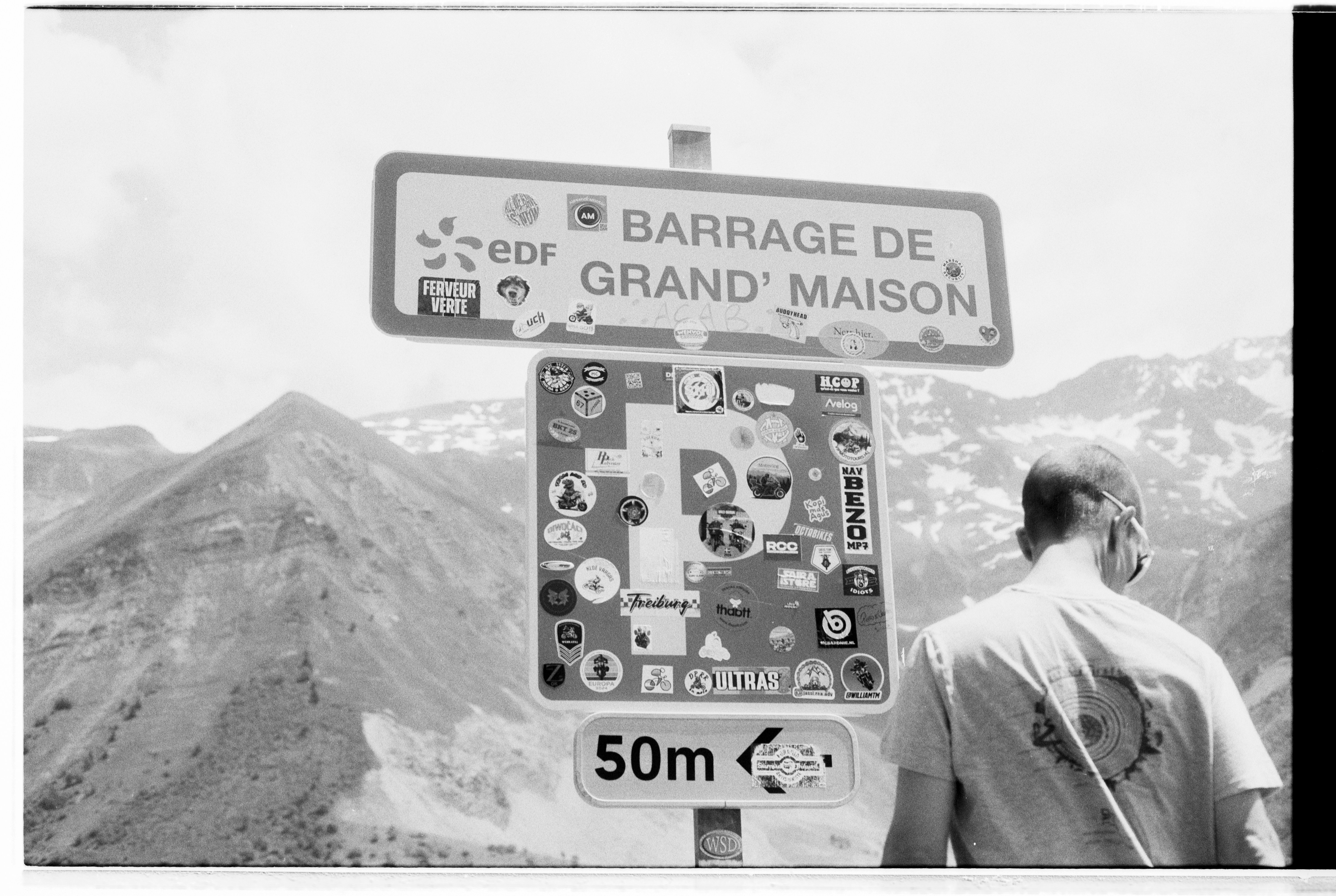Stickered Summit: A Stranger at the Grand Barrage