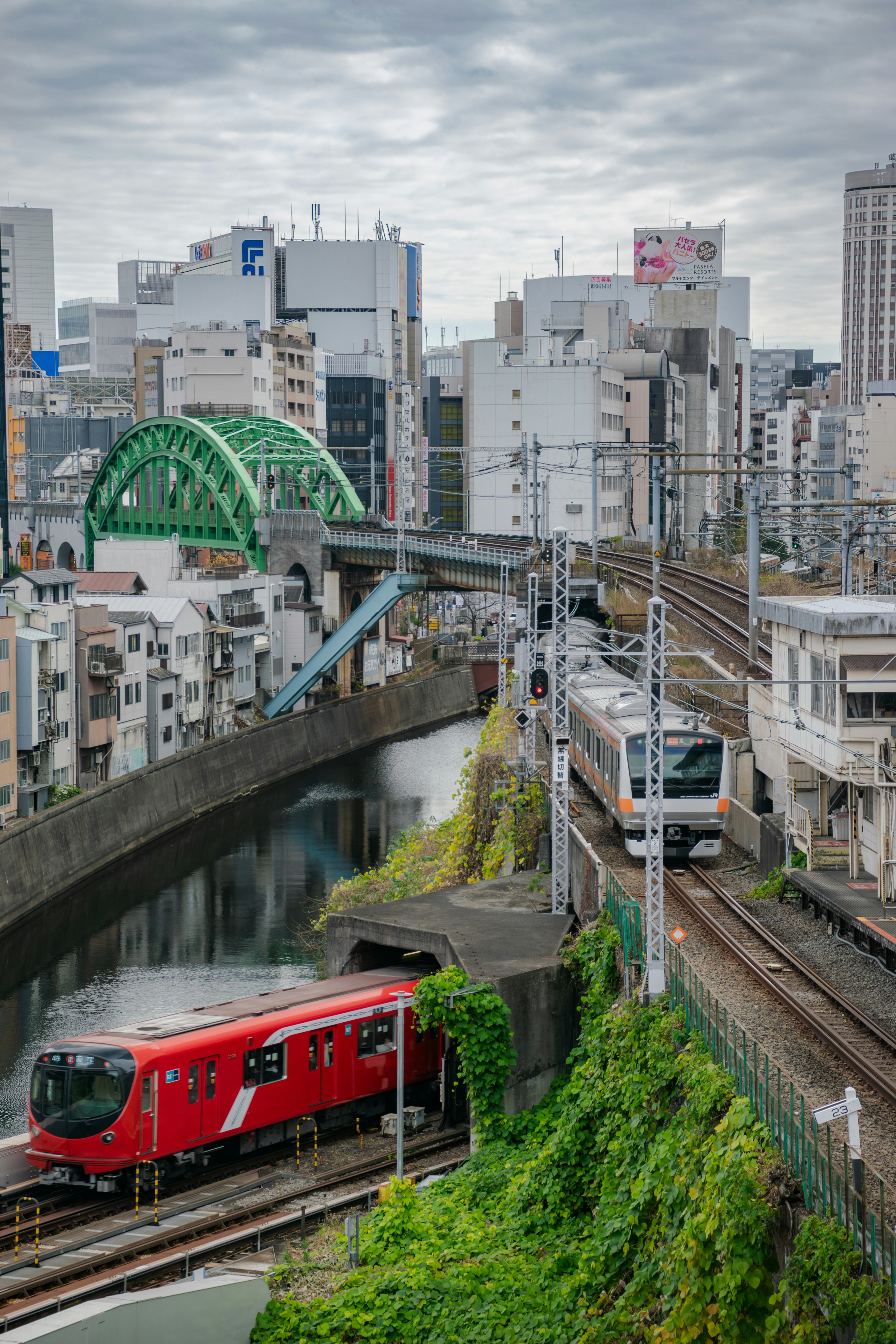 Trains in Tokyo near Manseibashi Bridge on a cloudy day. Tokyo, Japan, Jan/24