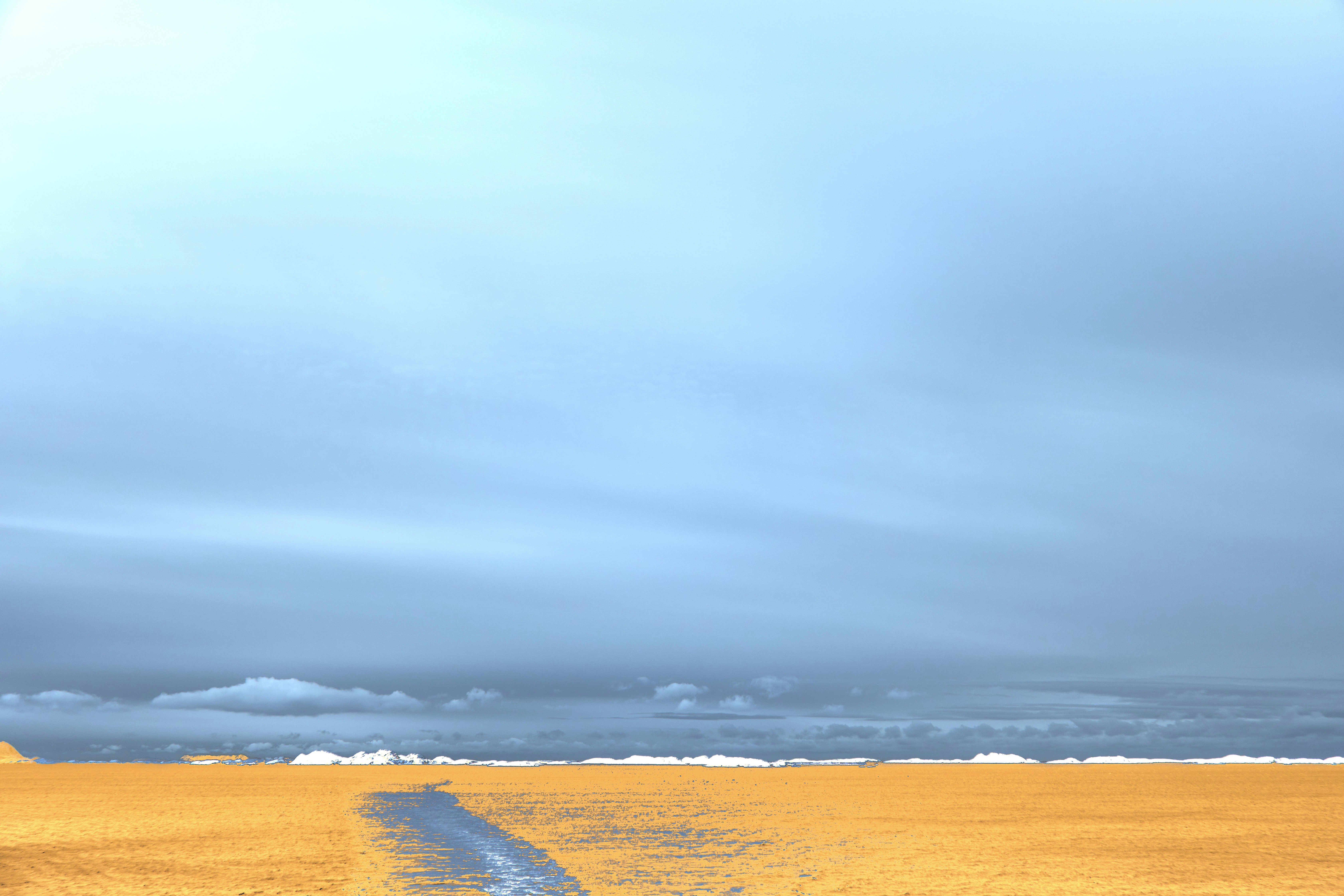 Golden Horizon: A Quiet Flush of Light Across a Desert Plain