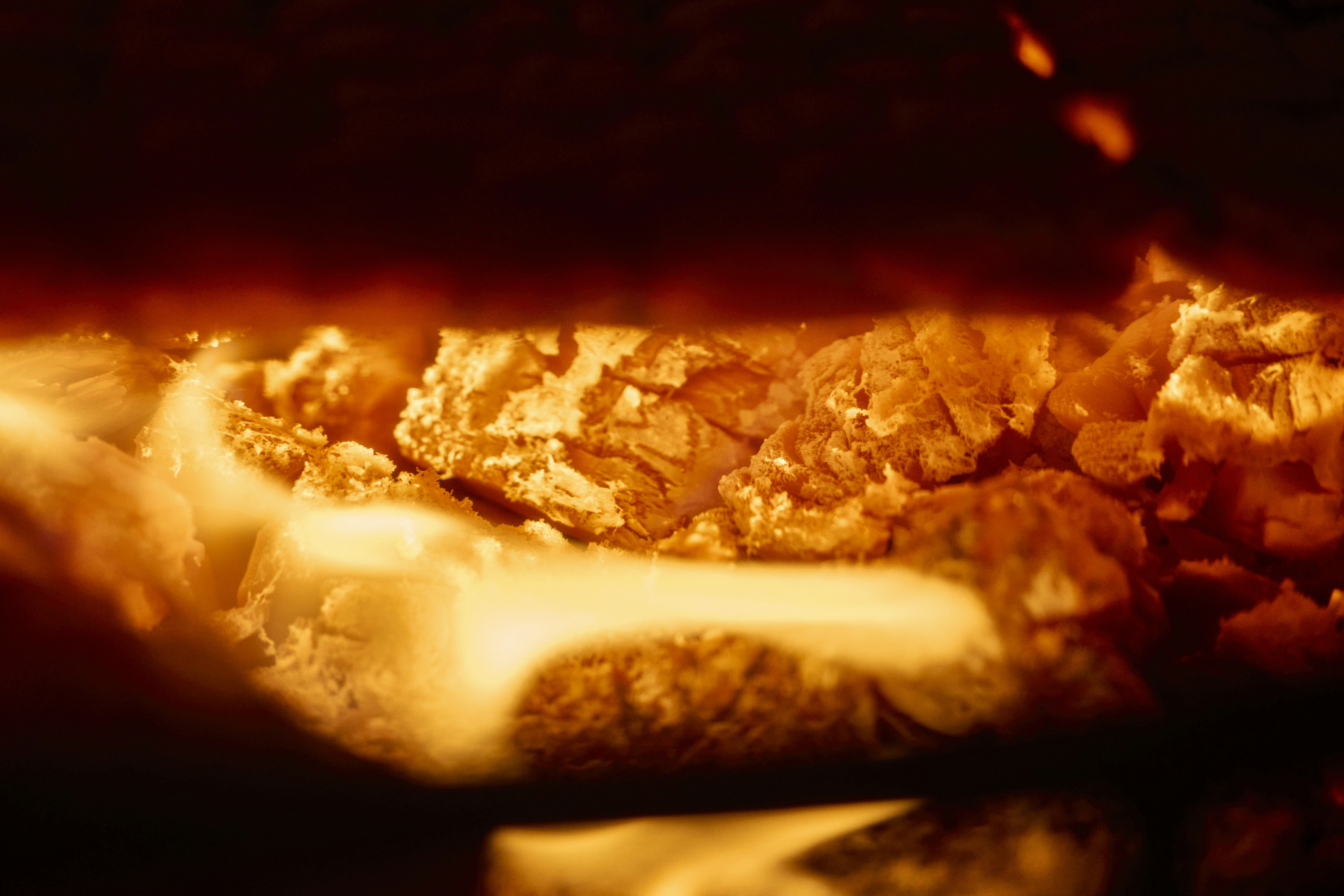 Ember Graze: A Close-Up of molten, glowing Coals