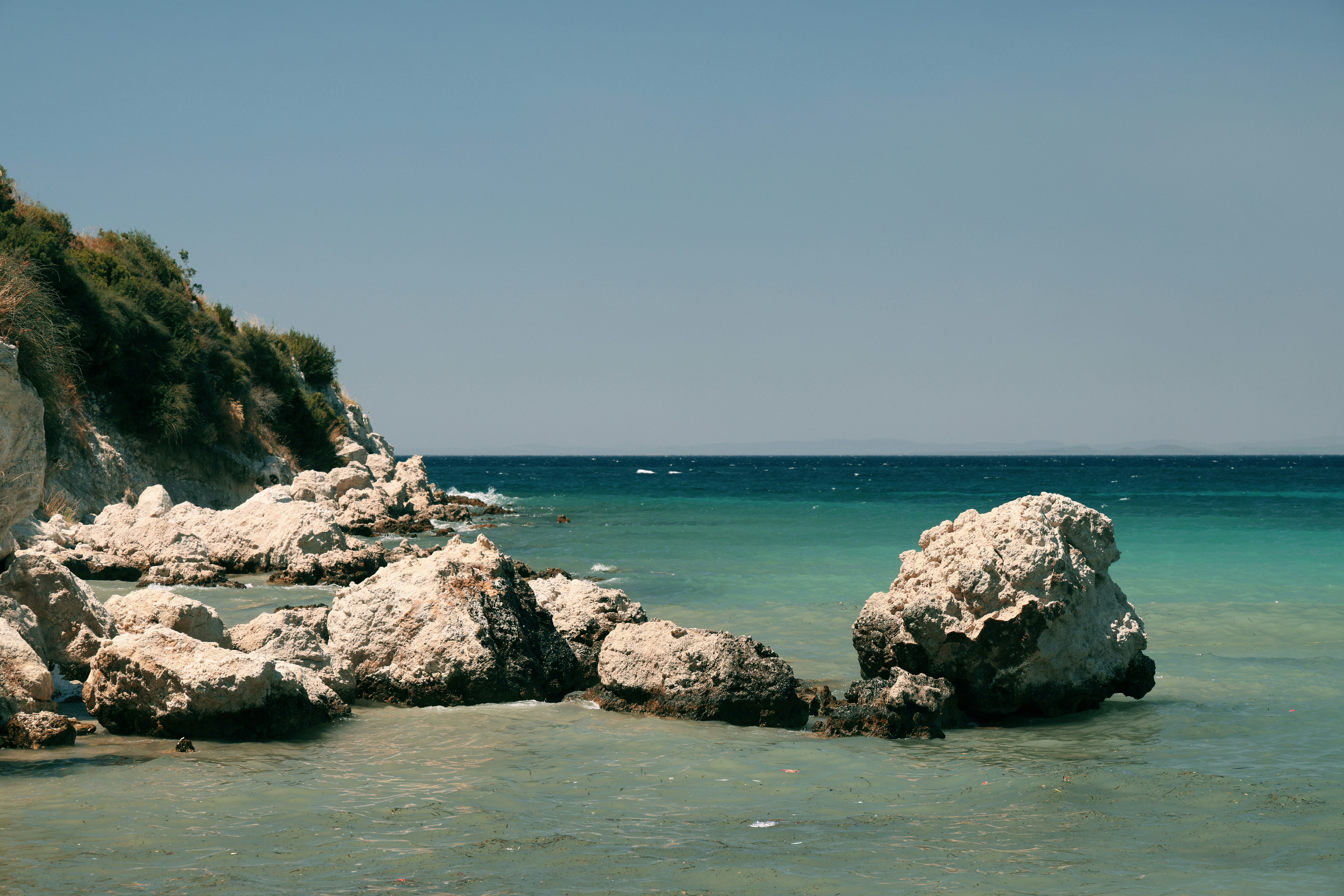 Coastal Rocks Quietly Guarding a Turquoise Horizon