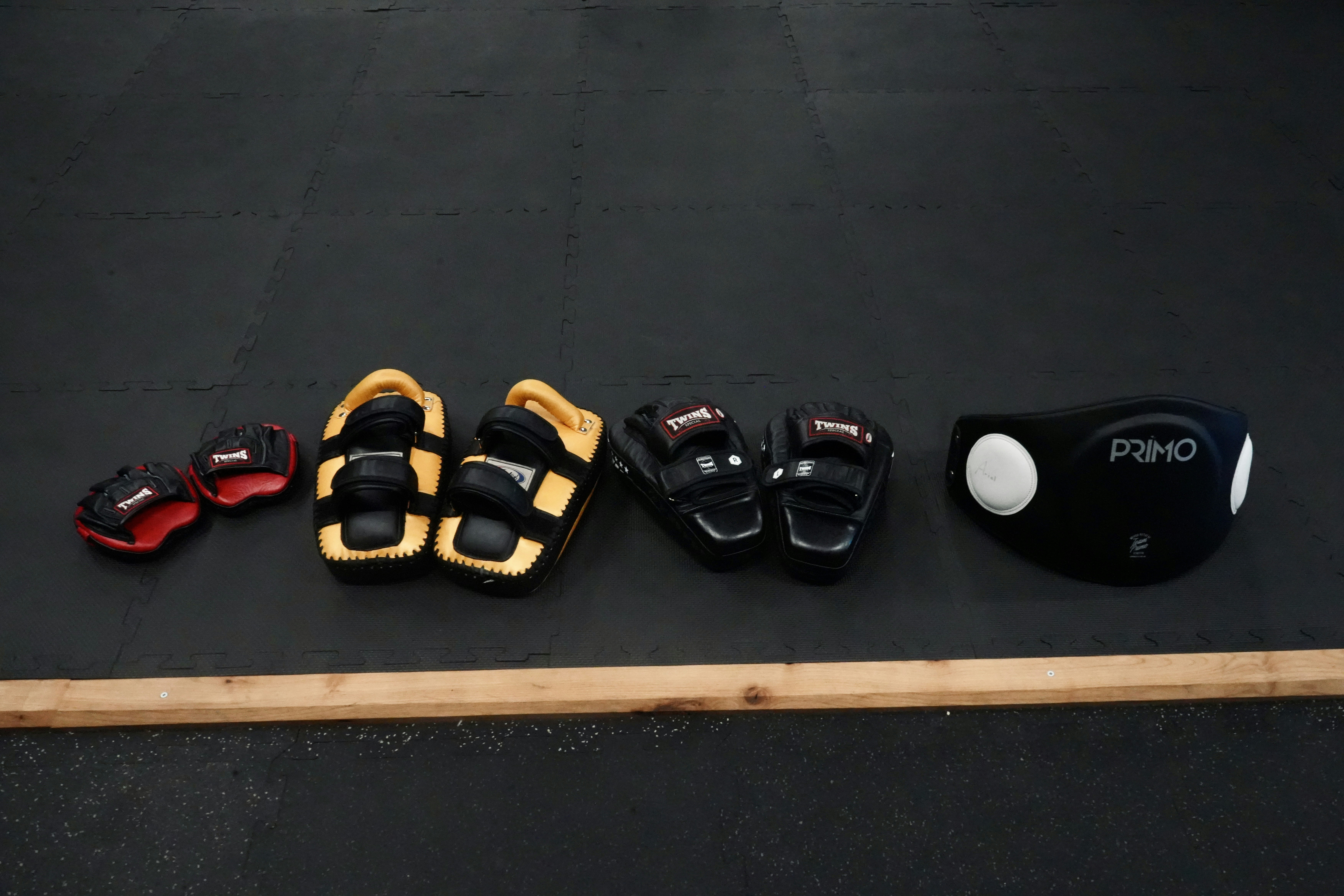 Line of Gear: Straps and Bar Resting on the Gym Floor