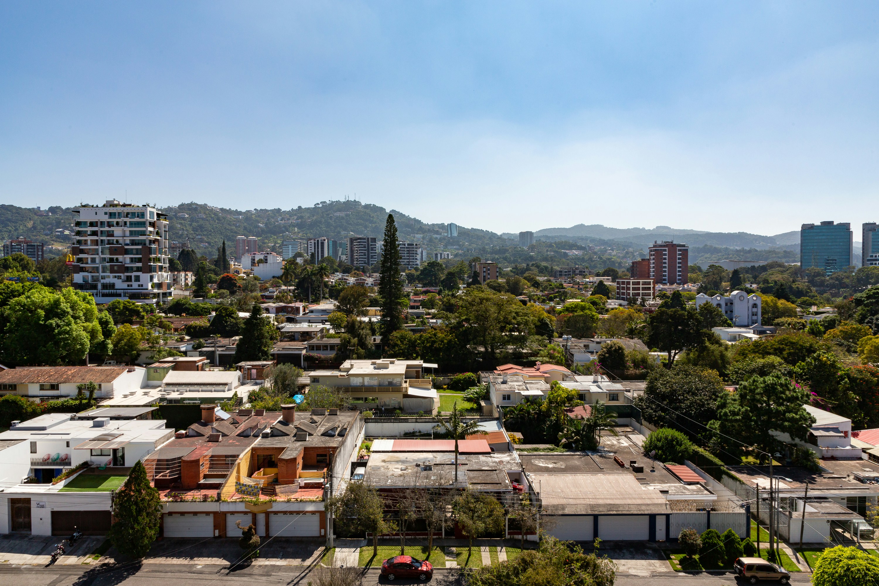 Sun-Soaked Valley: A Quiet Rooftop Panorama Over Suburban Hills