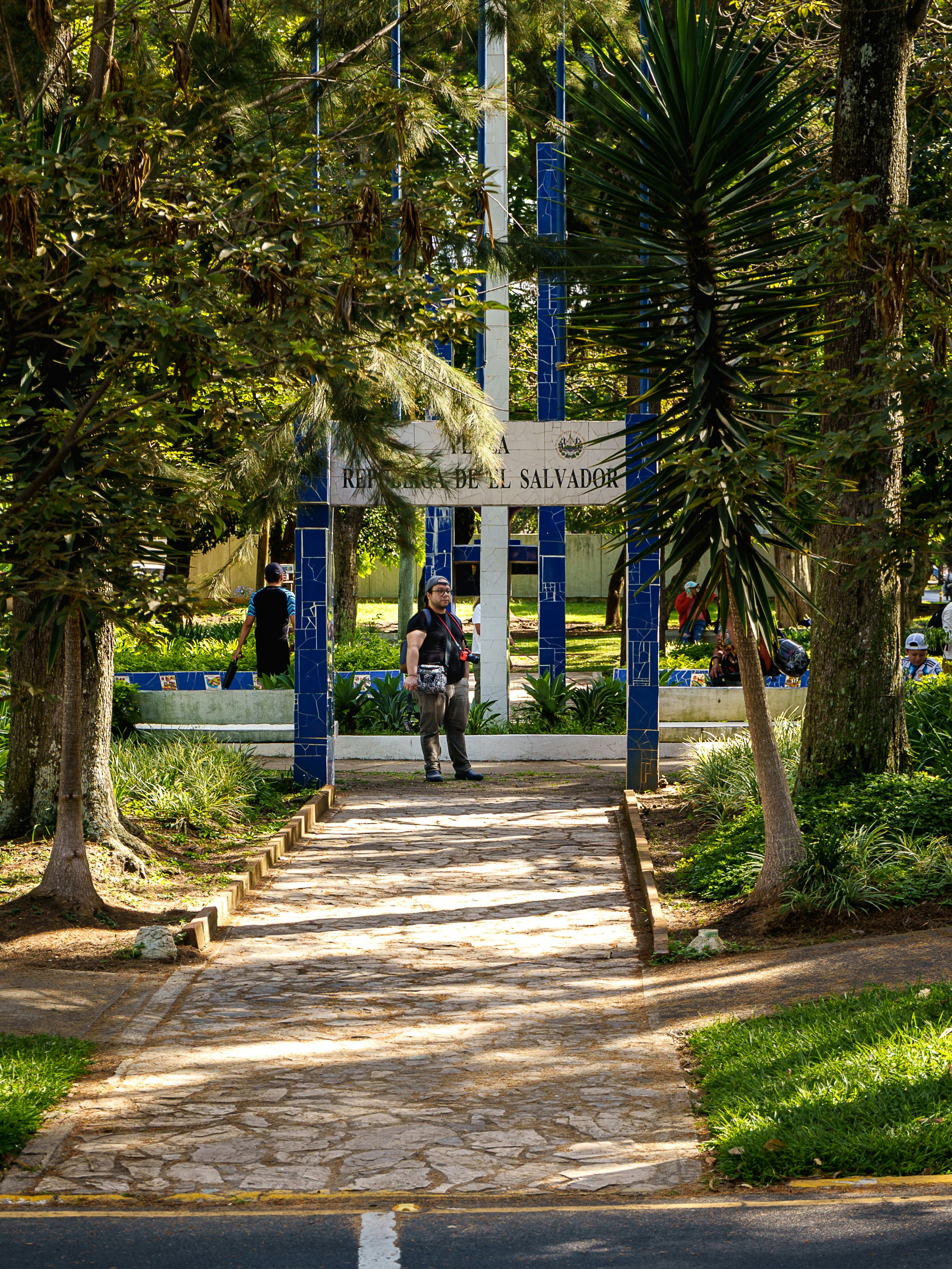 A Quiet Verge: Student under the Arc of Blue Tiles