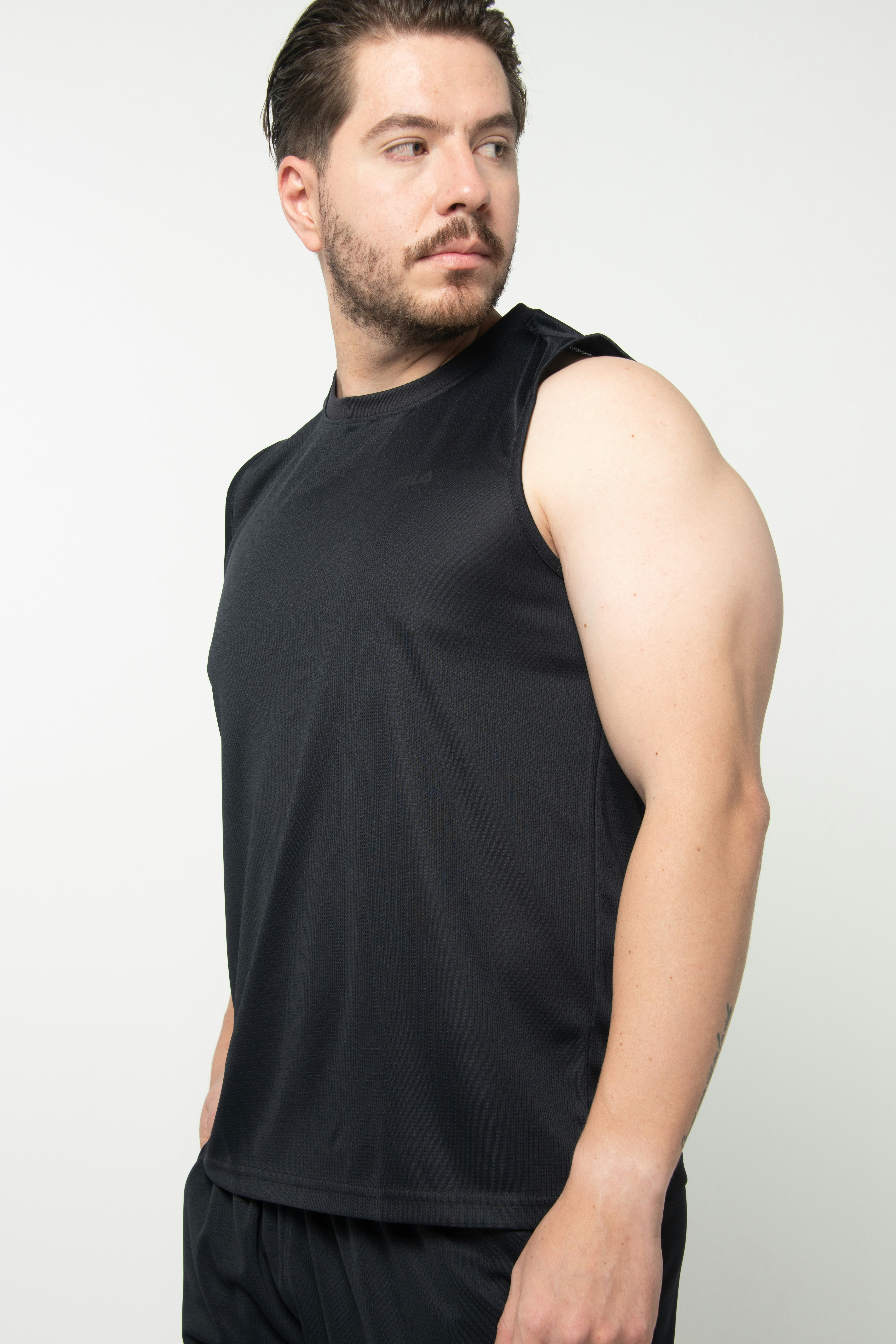 Athletic Presence: Portrait of Strength in a Sleek Black Tank